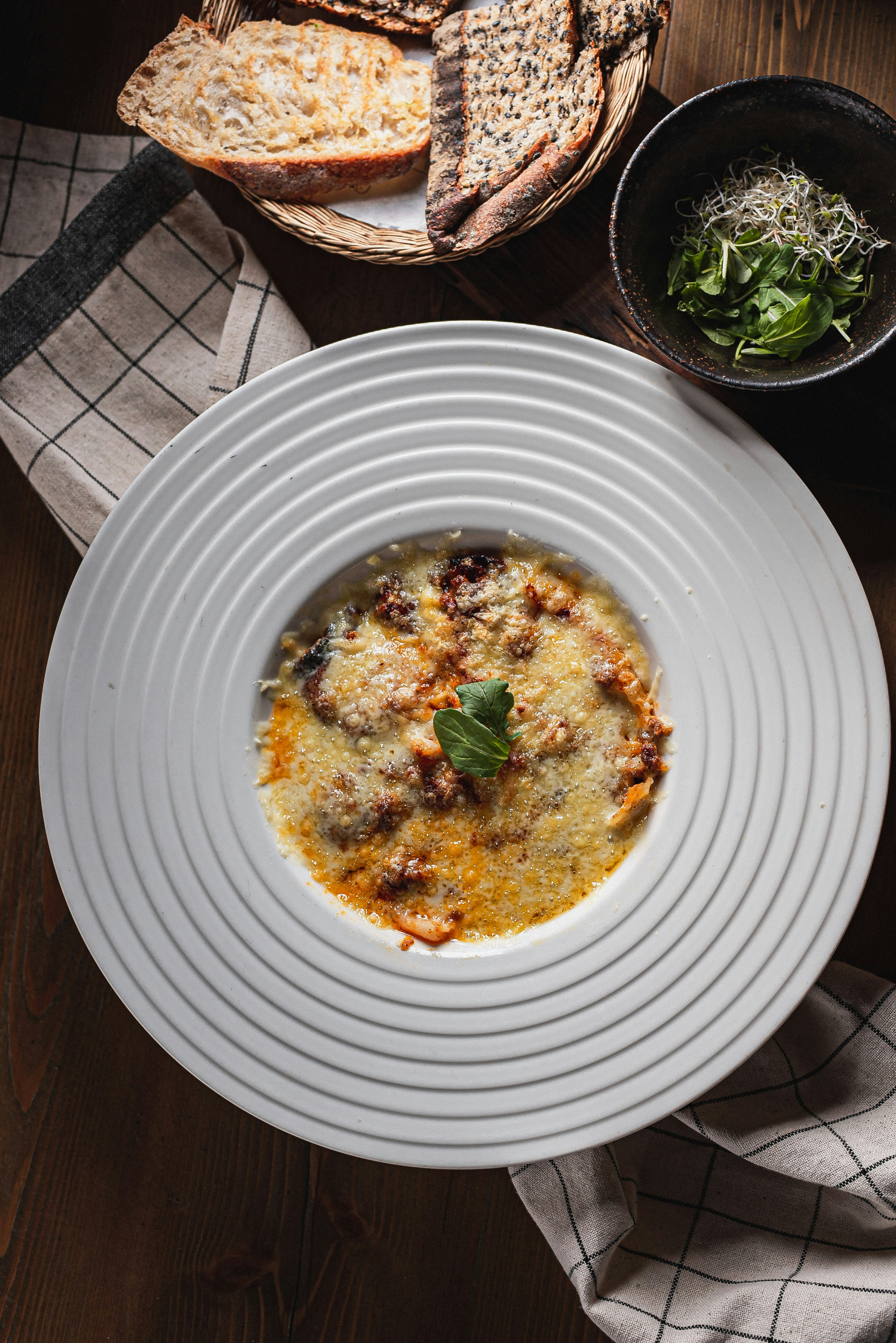 Creamy Bouillabaisse with Crispy Crust and Fresh Greens