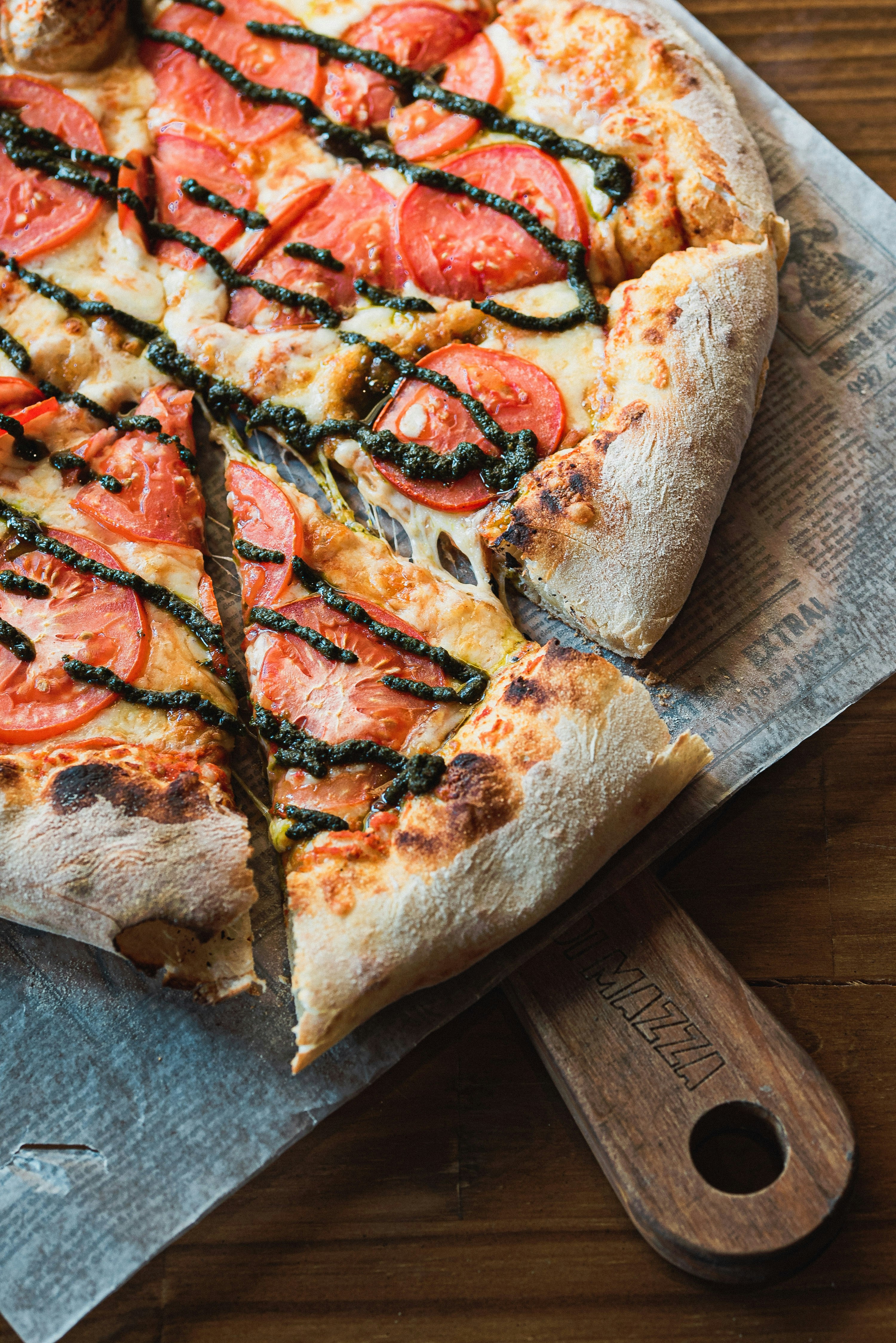 Charred-edge Pepperoni Pizza on a Rustic Board