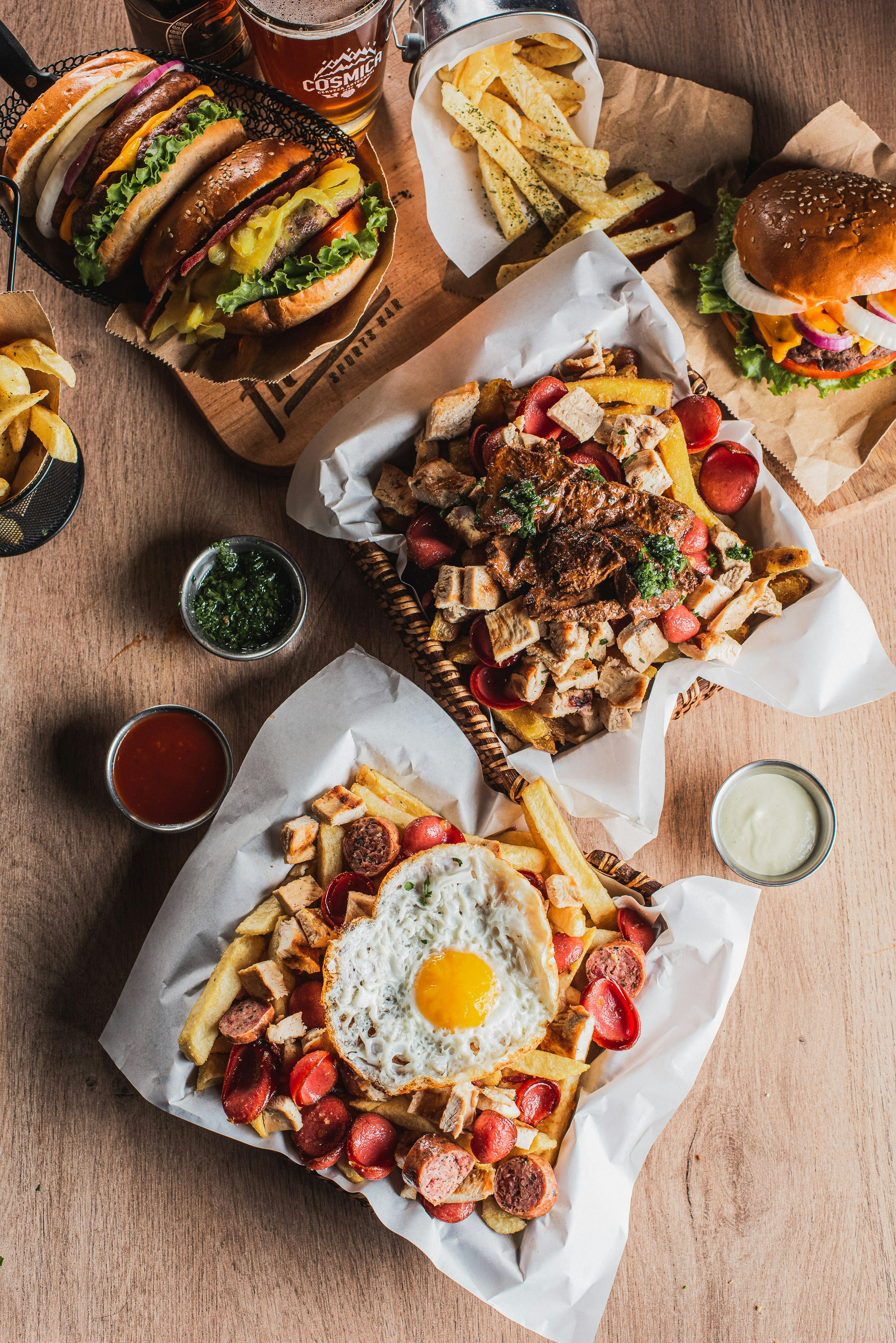 Overhead Feast: A Tangle of Burgers, Fries, and Savory Toppings
