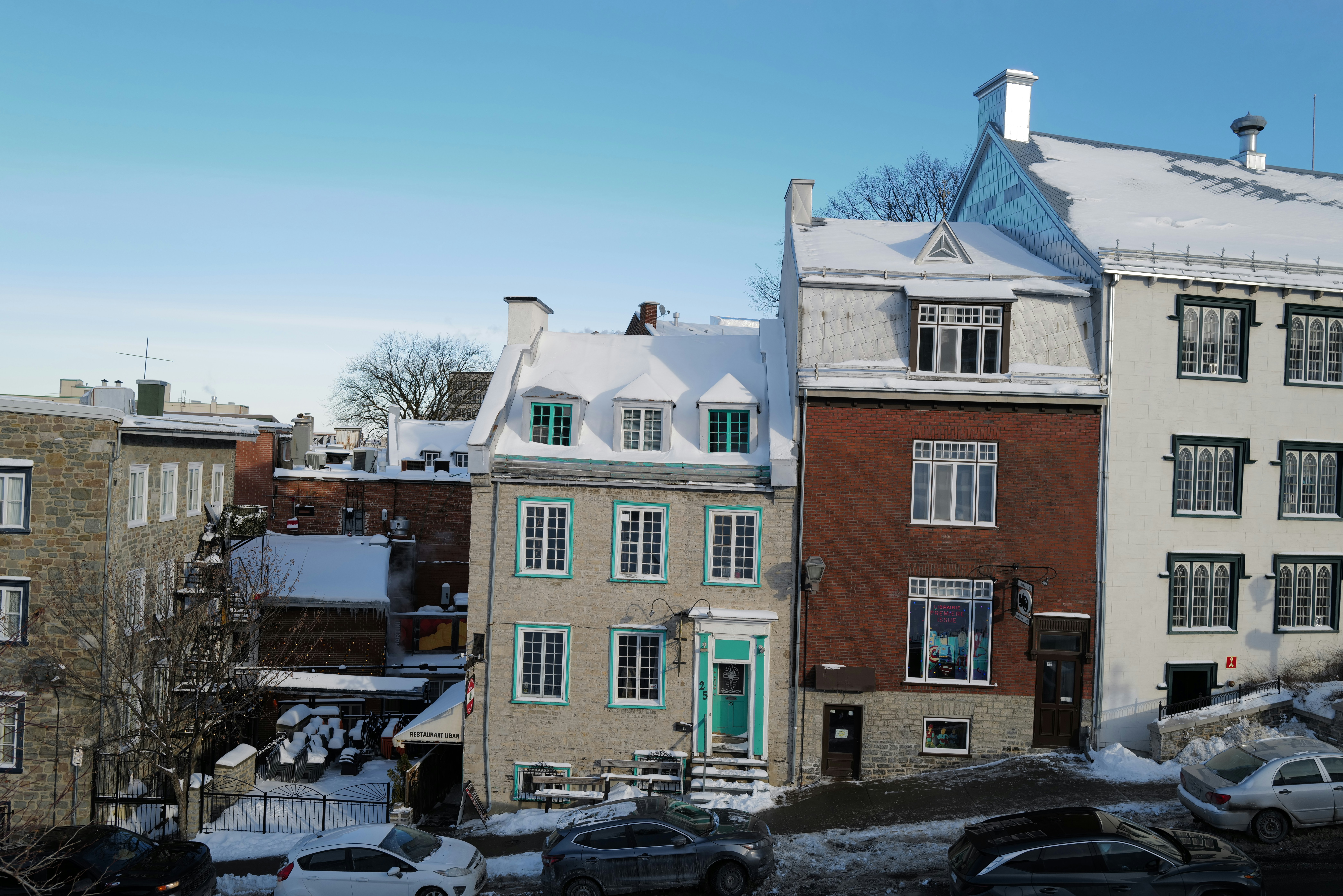 Snowbound Row: Facades Standing Between Street and Sky