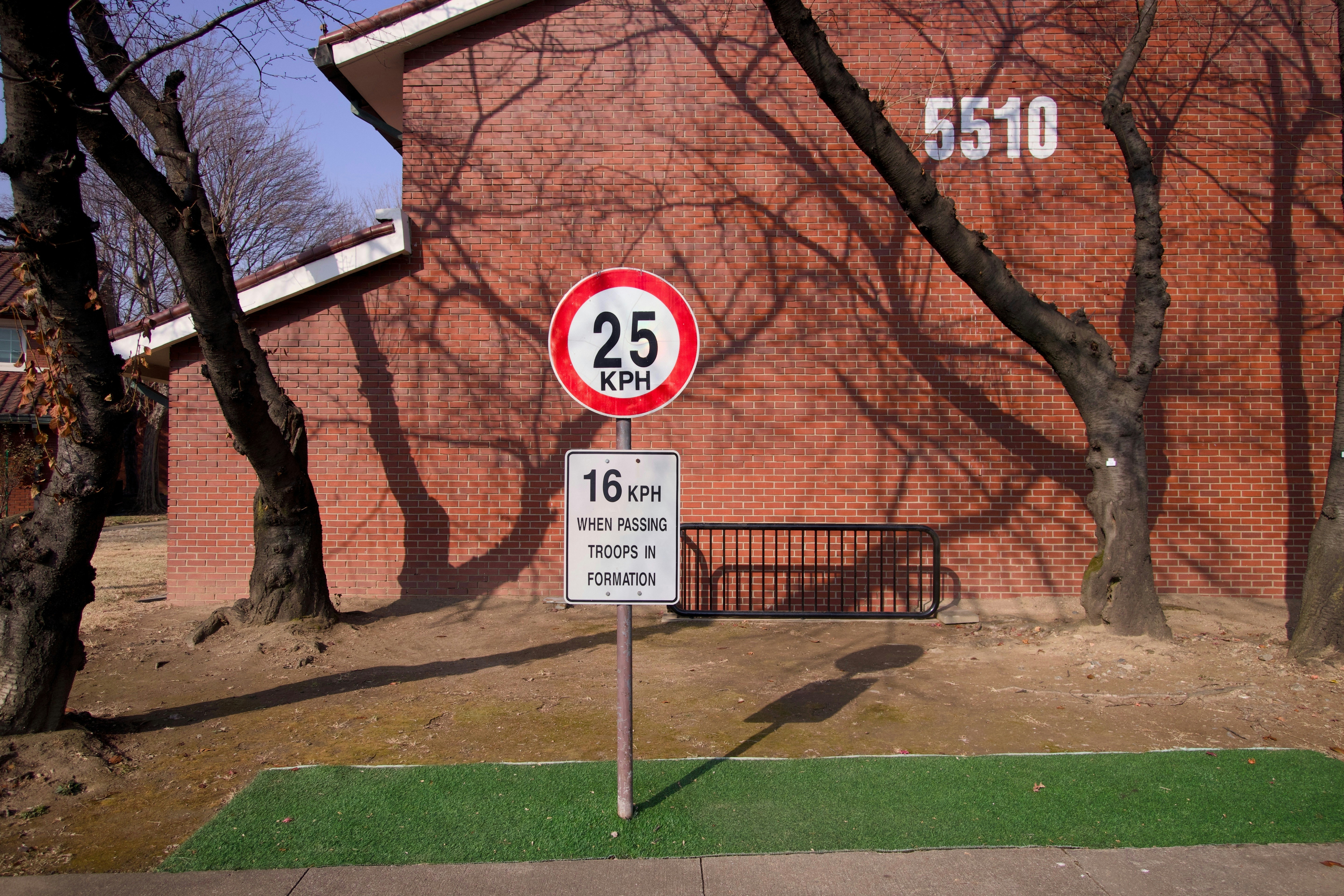 Speed limit sign with 25 kph displayed photo – Free Brick wall Image on ...