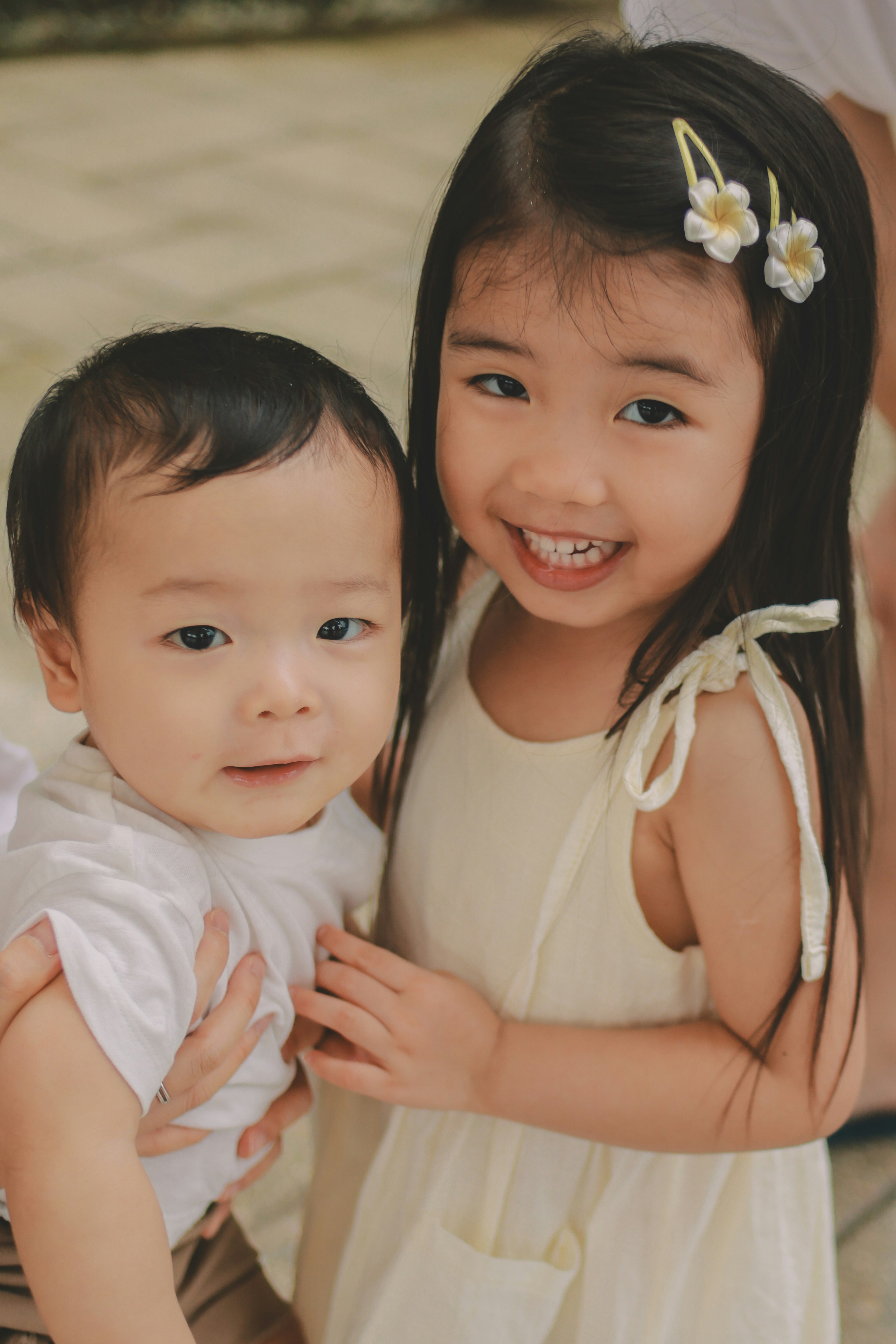 Two young children smiling at the camera. photo – Free Girl Image on ...
