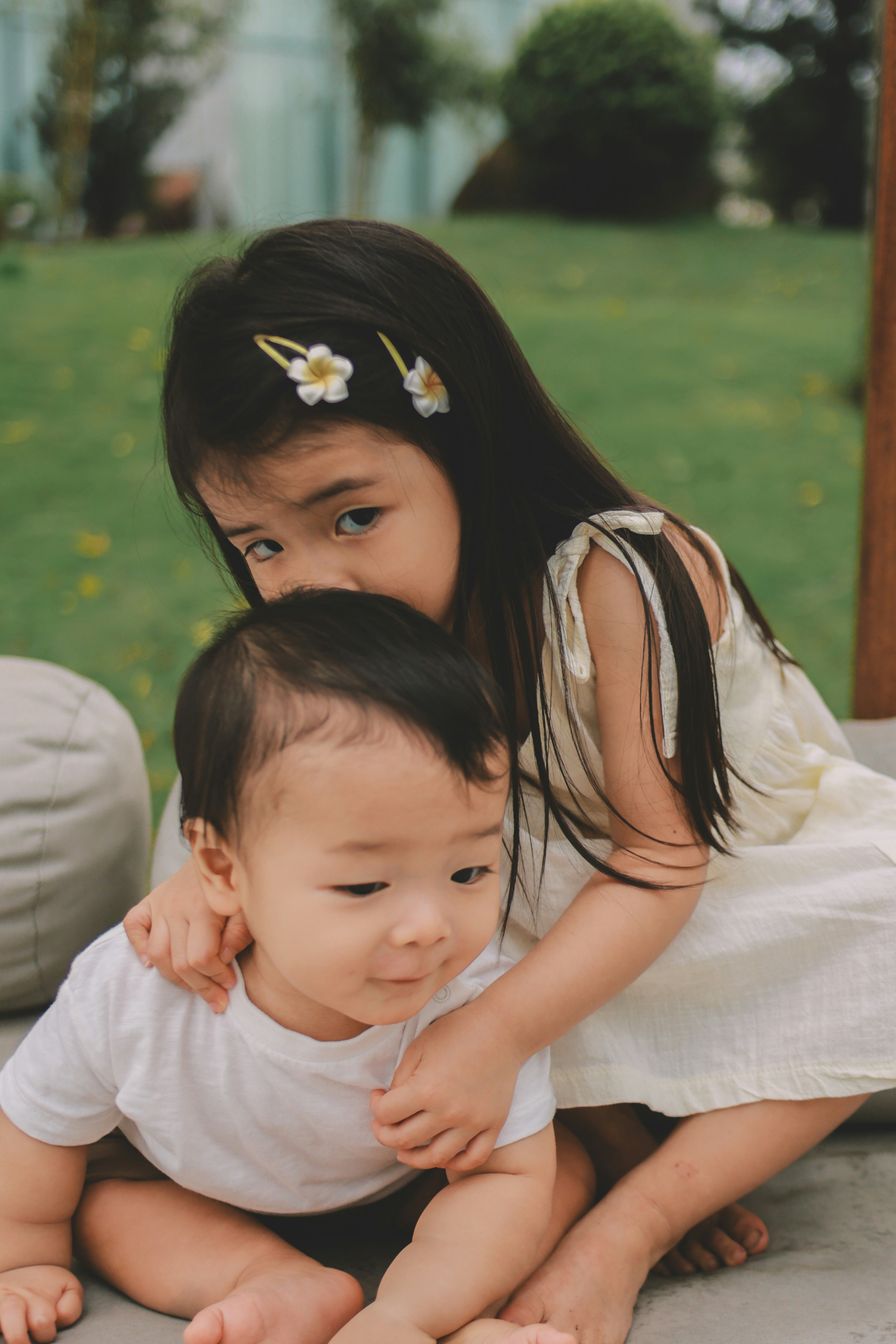 Sibling Moment: A Protective Cheerful Gaze