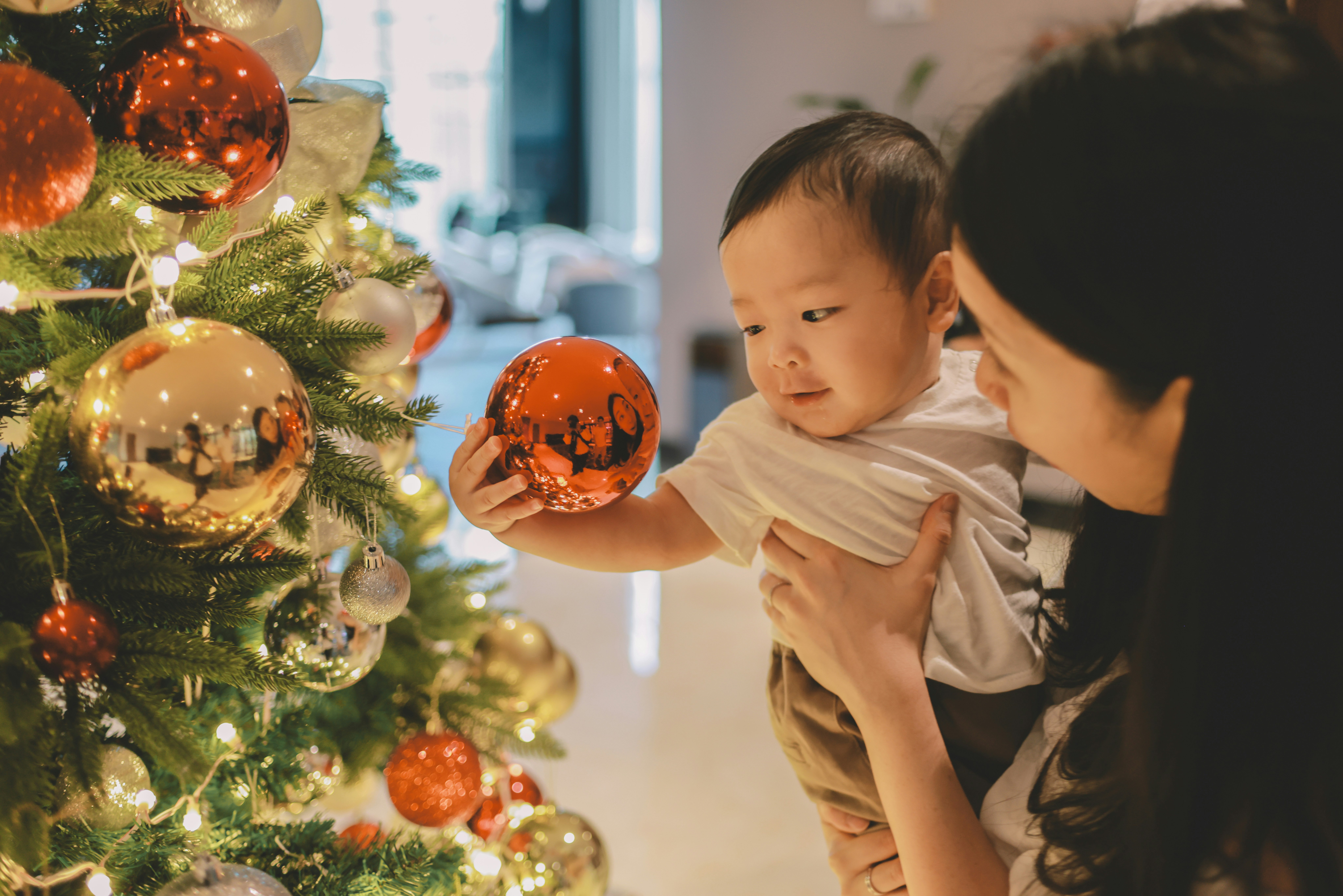 Baby versus Christmas Ornament: A Gentle Moment by the Tree