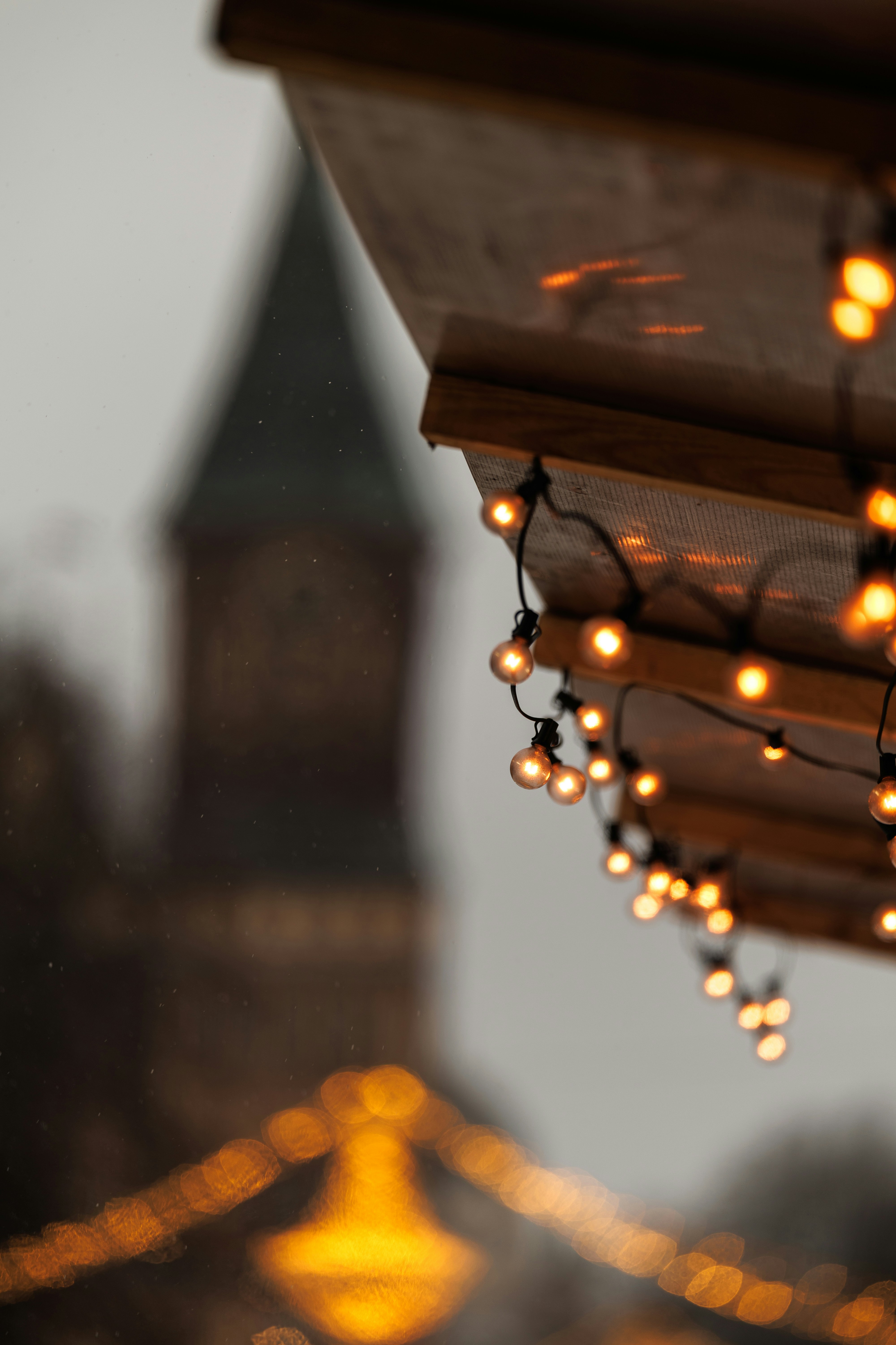 Glow and Lace: Evening Festoon at the Fog-Laden Square