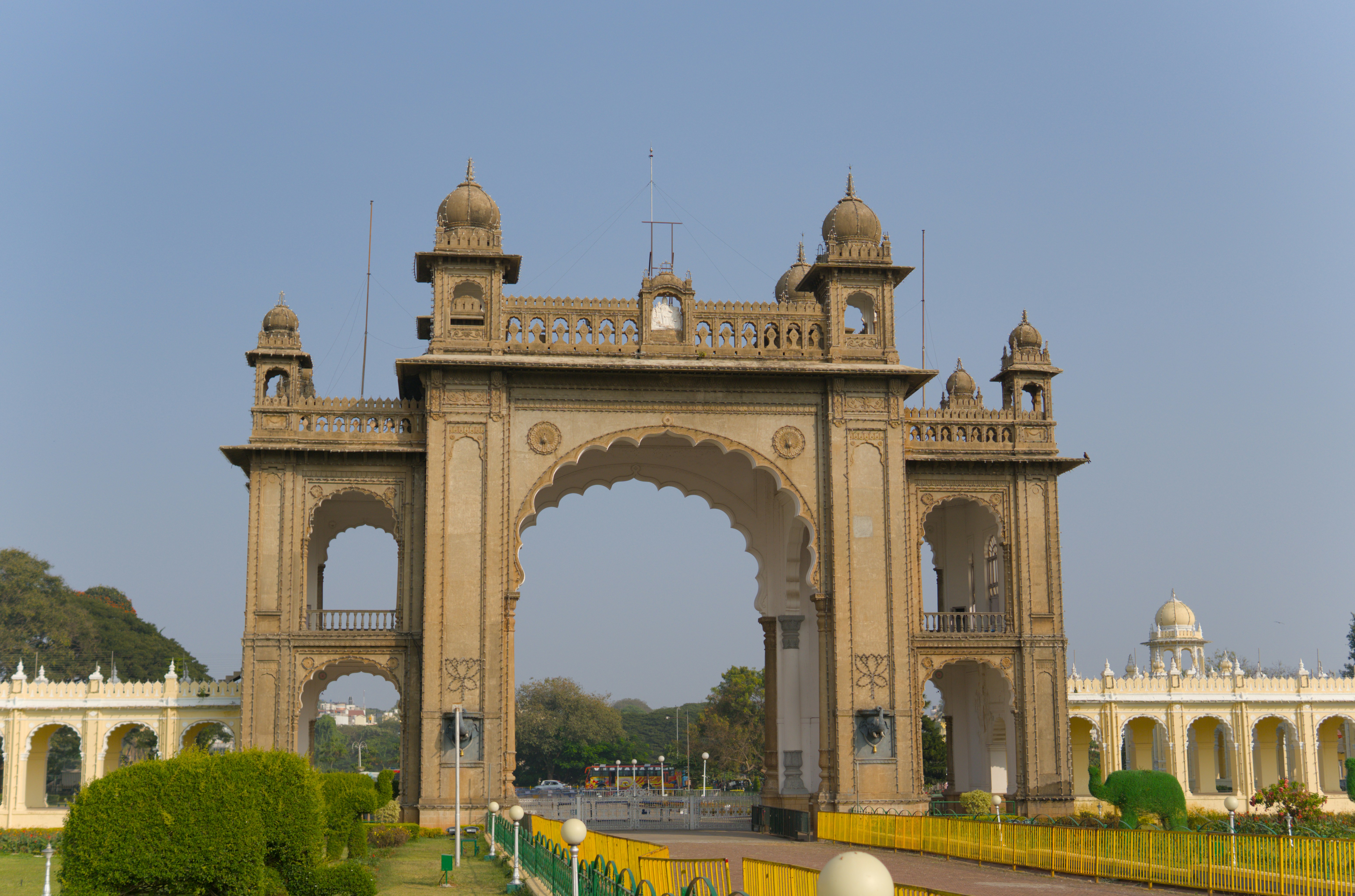 Granite Arch of Ceremony: A Monumental Gateway Framing a Sunlit Courtyard