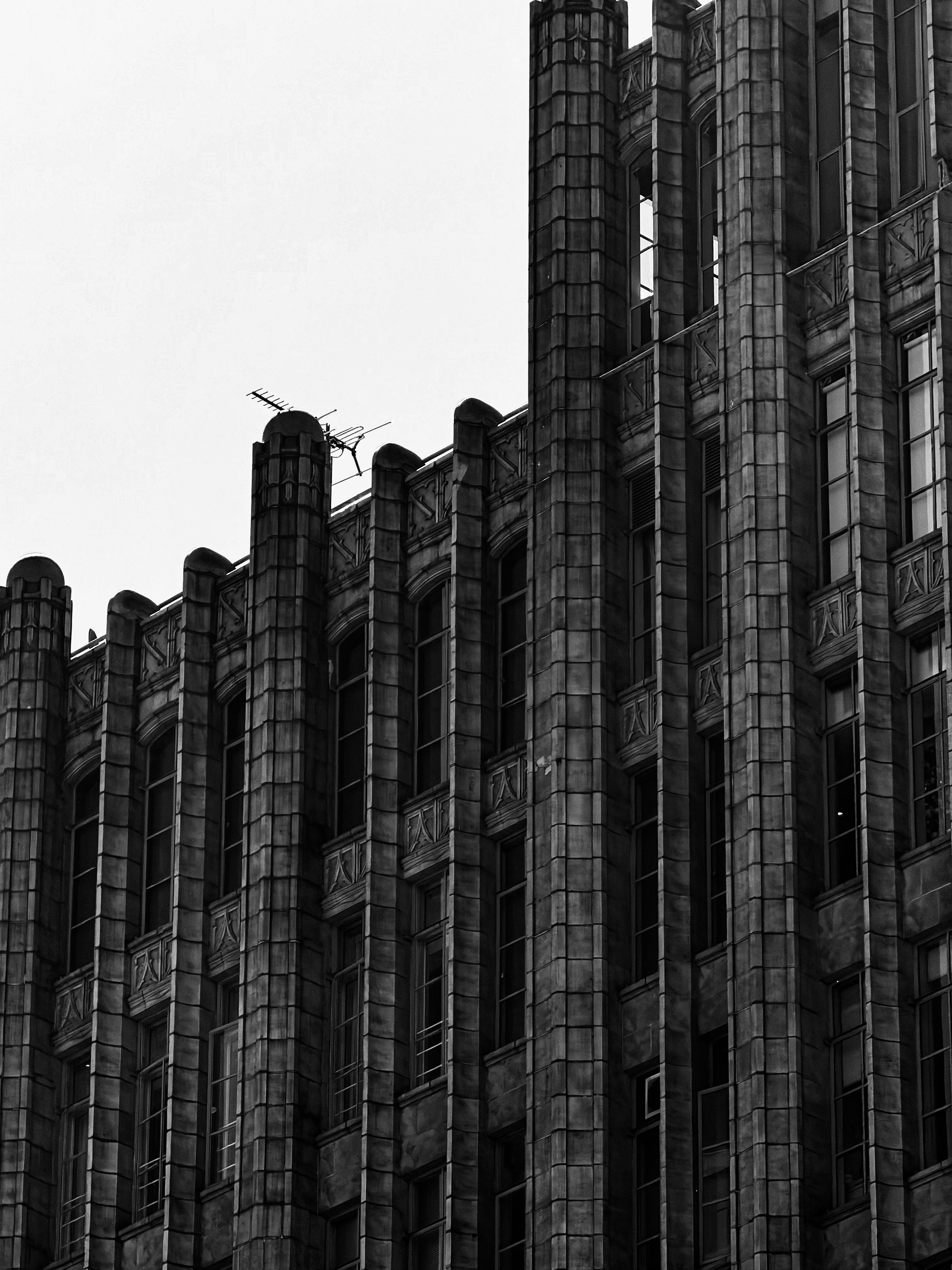 Vertical Echoes: A Monochrome Facade of Repeating Turrets
