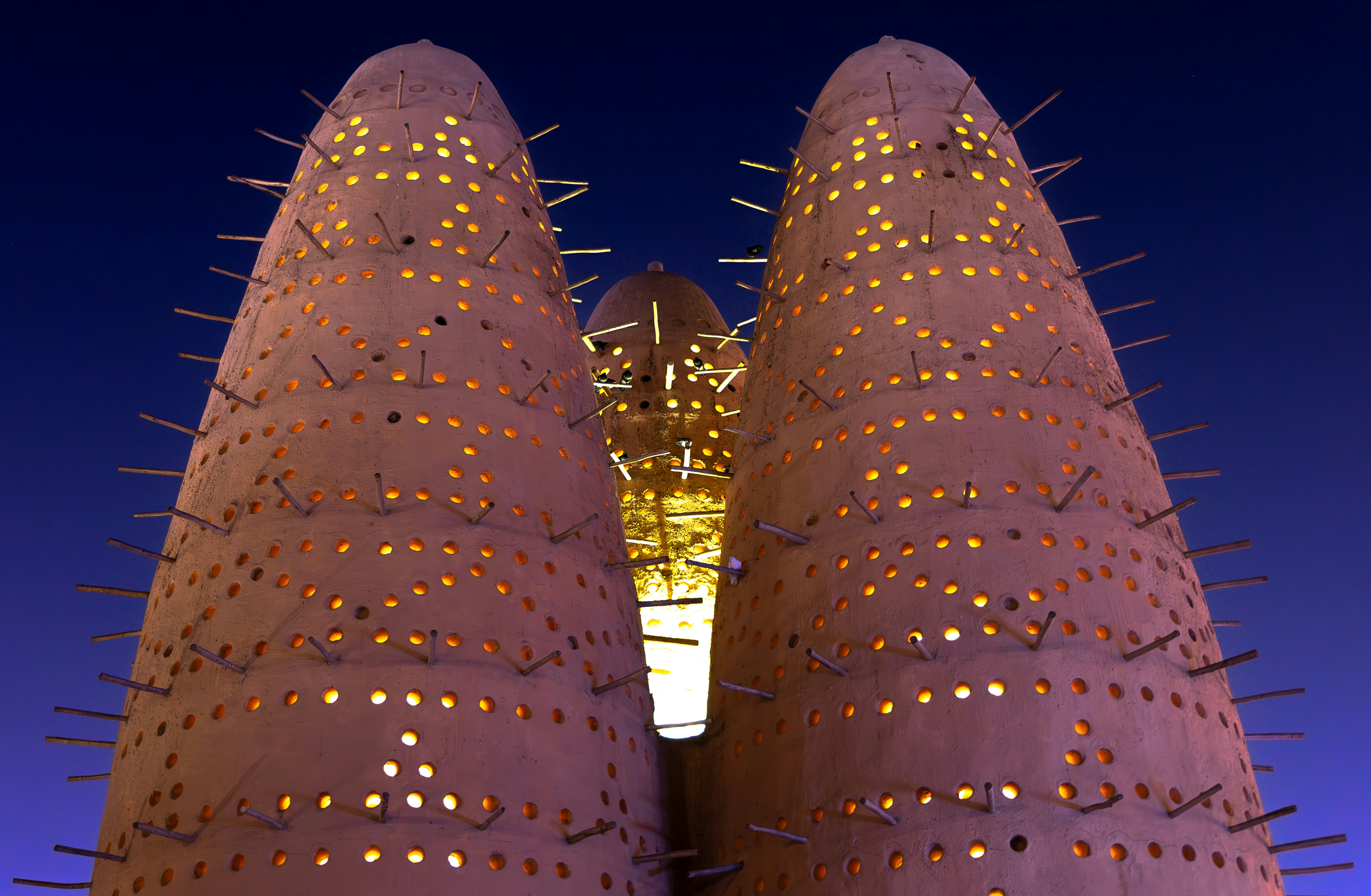 Conelicious Towers Under Night Sky