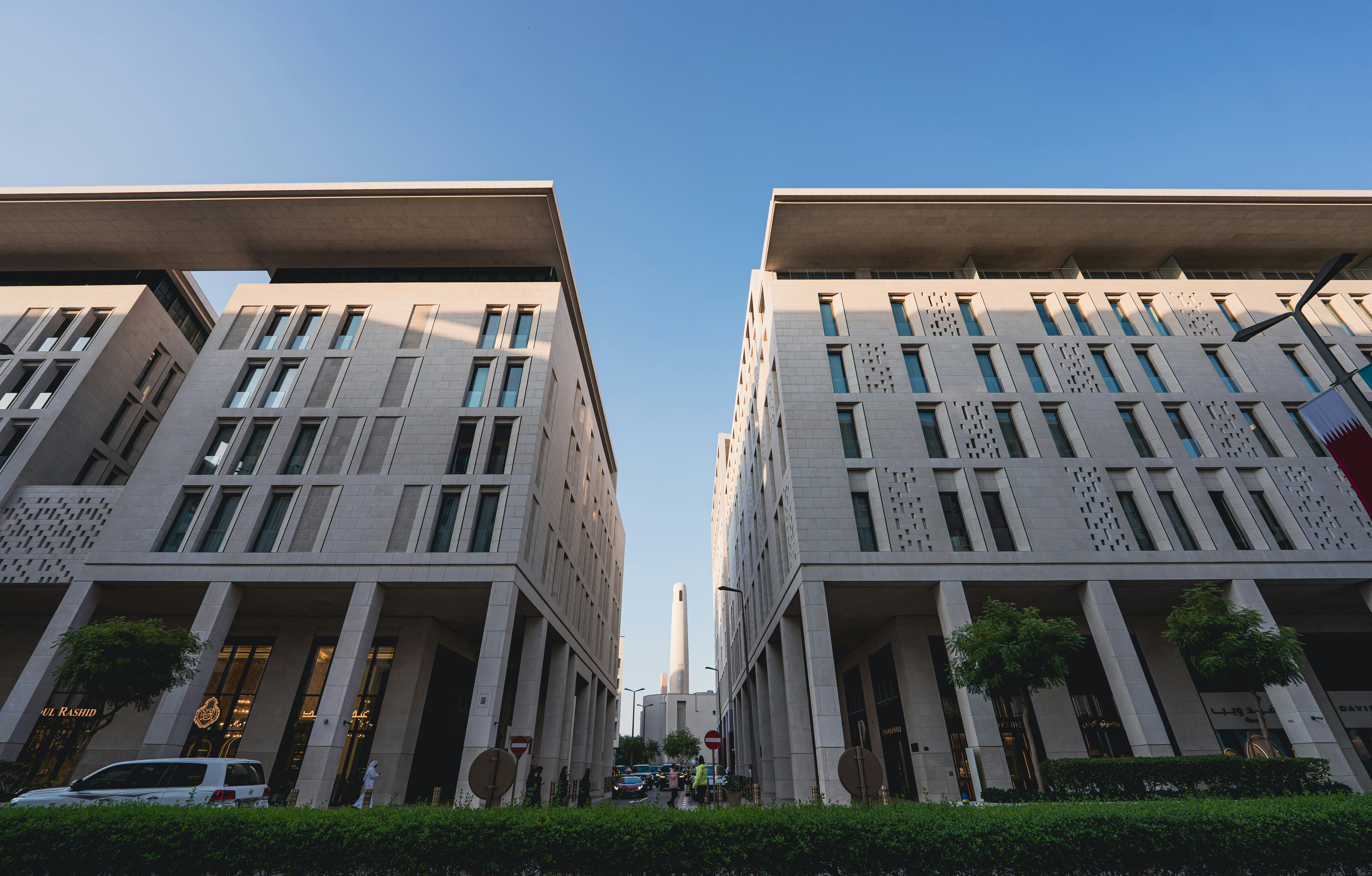 Symmetrical Court: Twin Modern Facades Reaching Toward the Sky