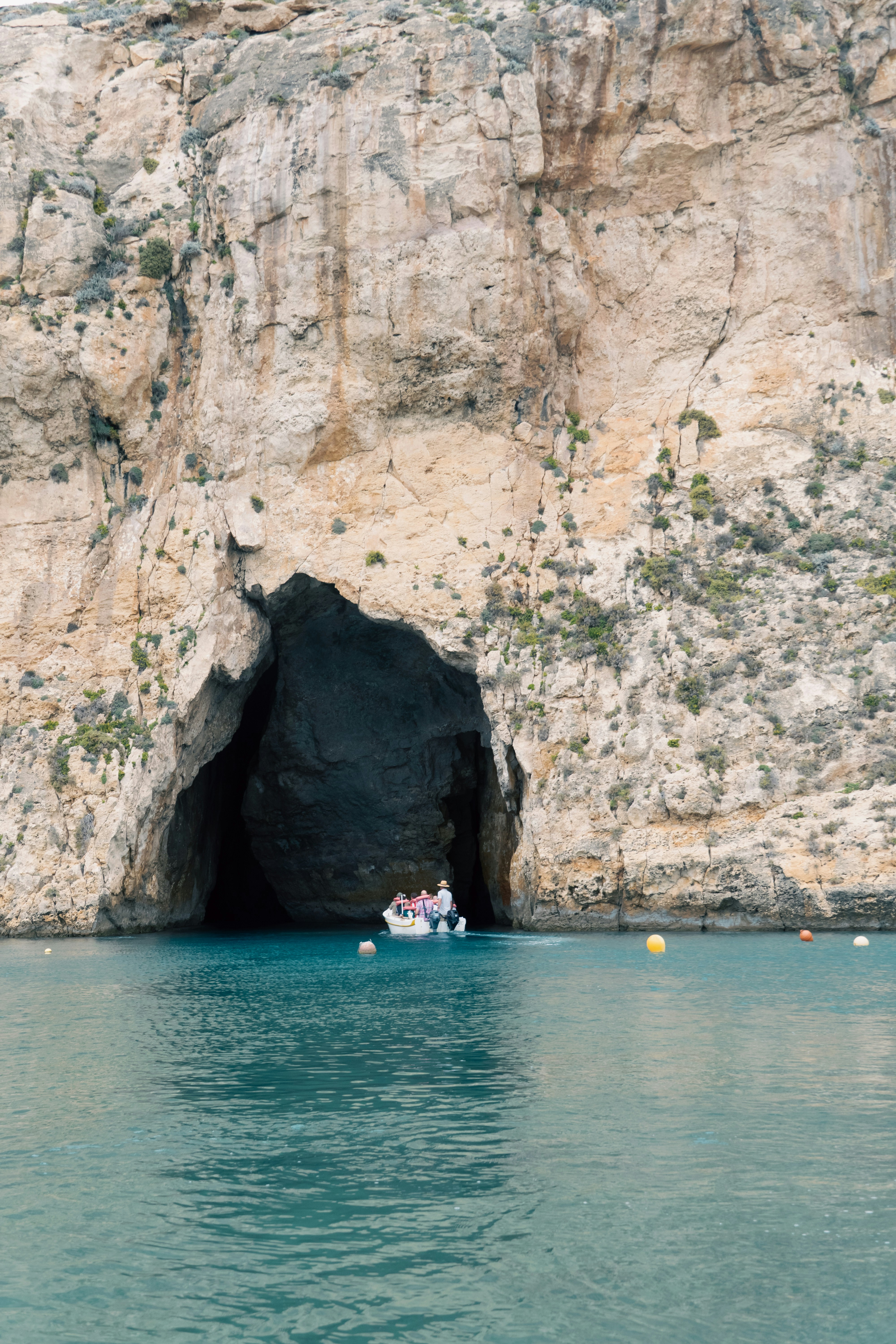 Hidden Sea Cave Emerges from Coastal Cliff