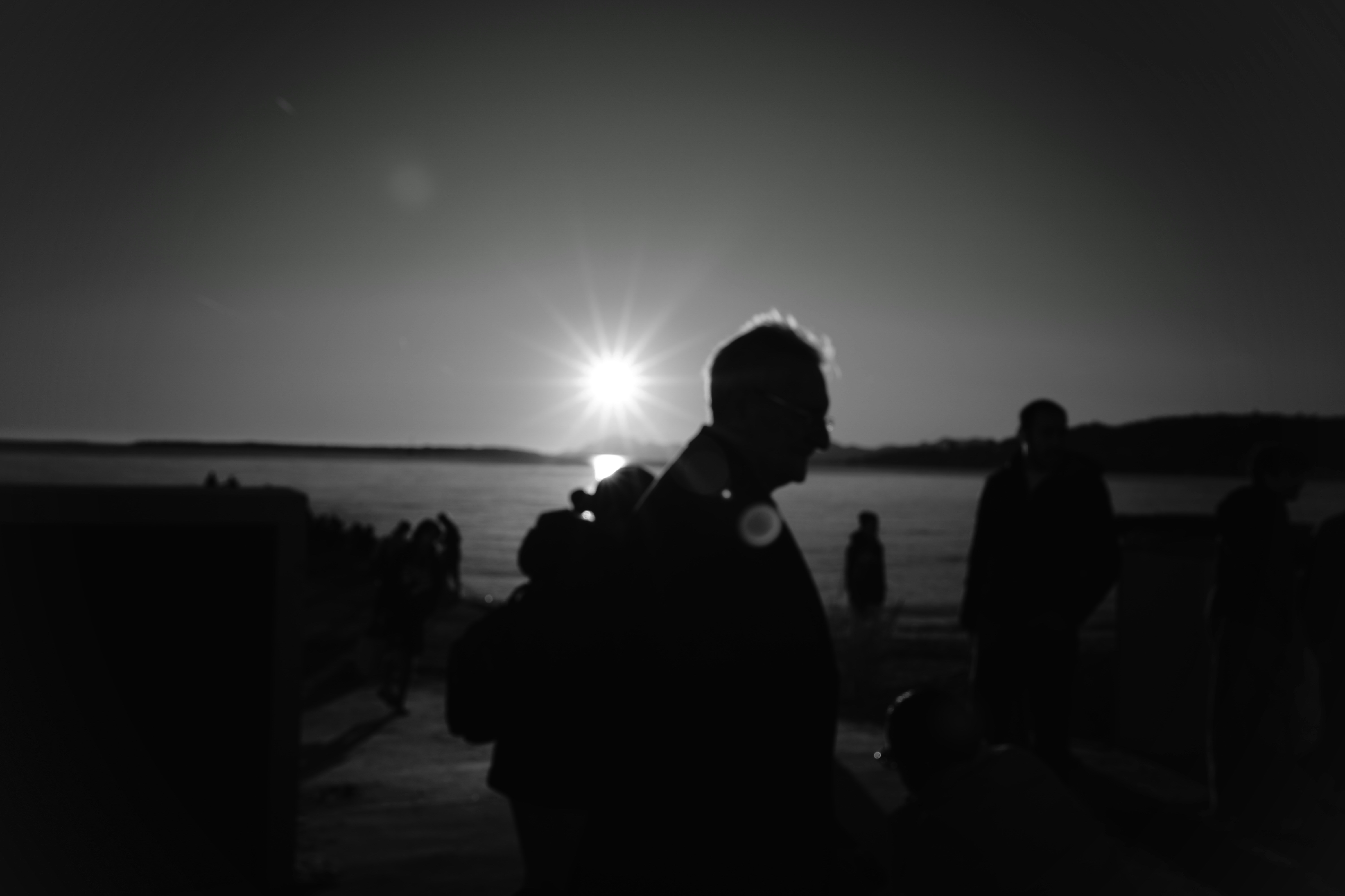 Backlit silhouettes at the waterfront
