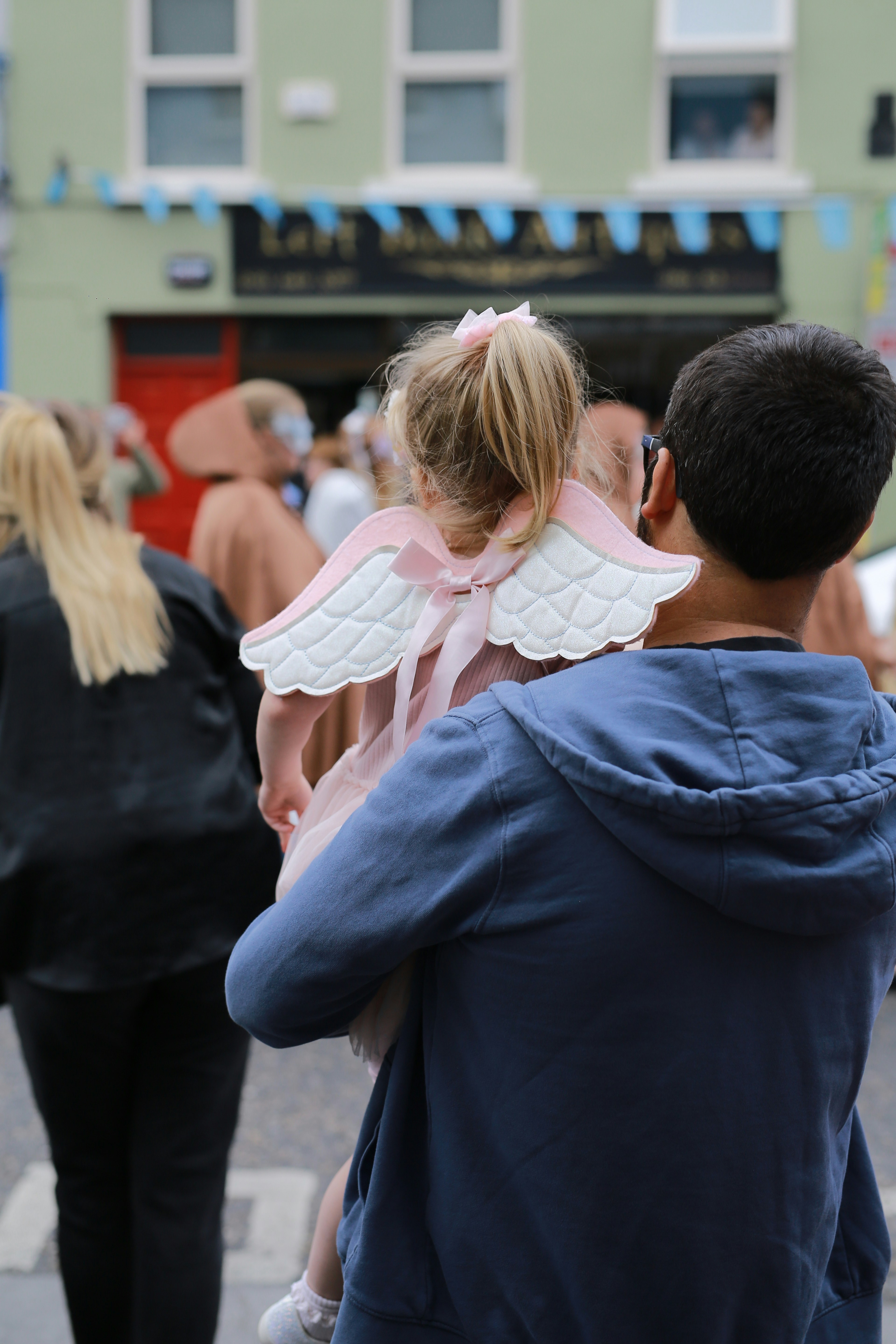 Angel in the Crowd: A Little Guardian in Pink