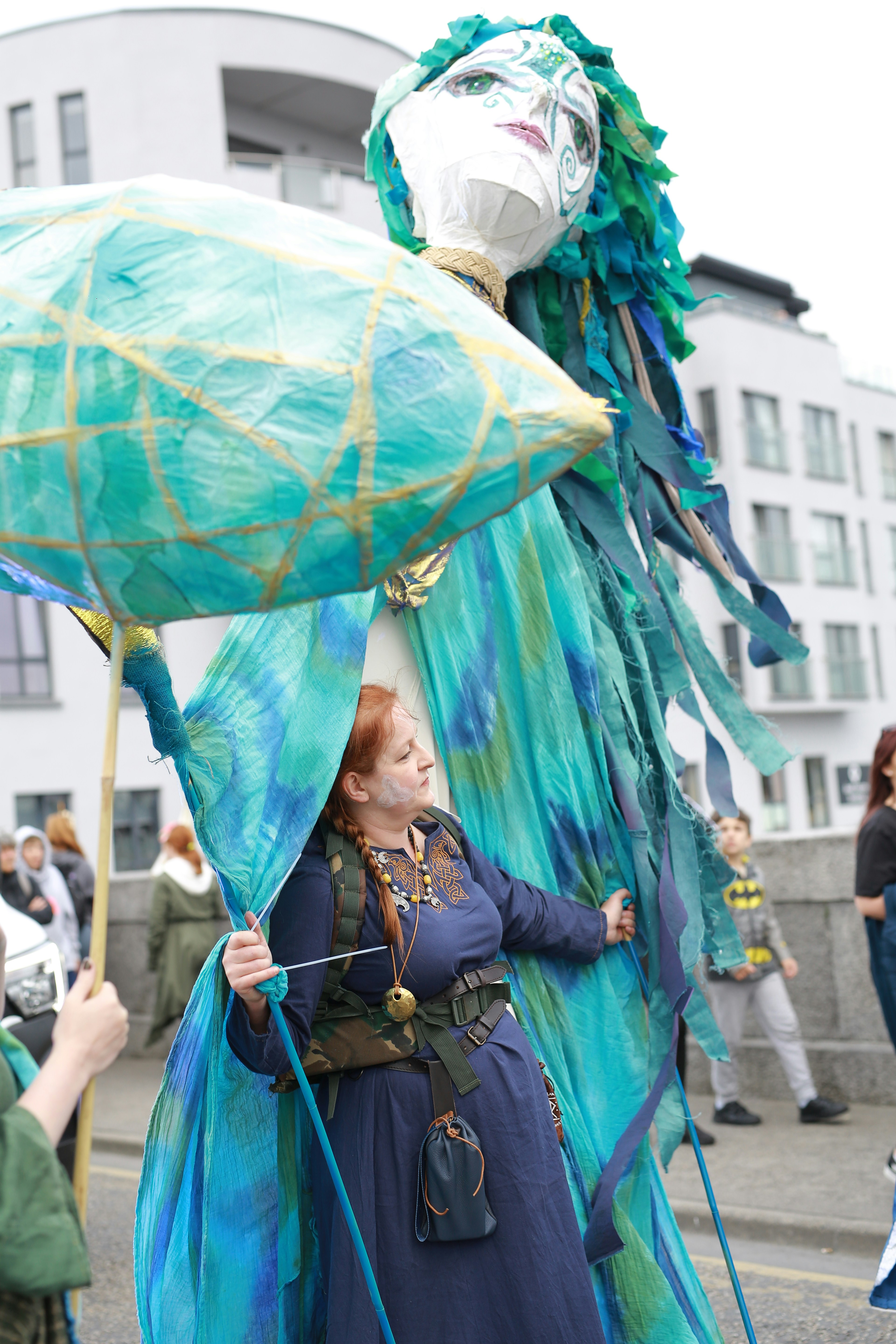 Emerging Dragon: A Costumed Parade Giant Towers Over the Crowd