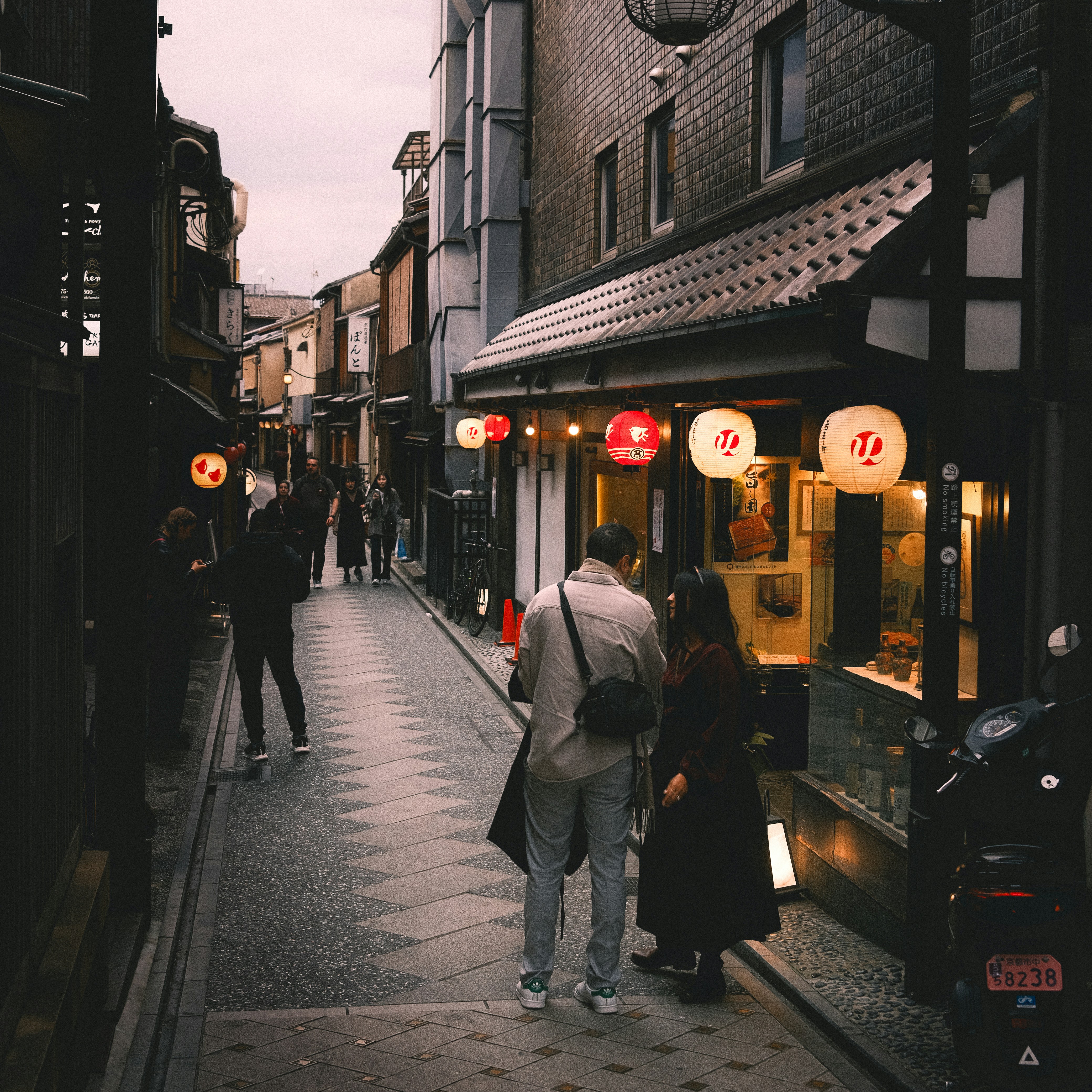 Lanterns and Quiet Steps: A Shady Alley in a Japanese Street Market