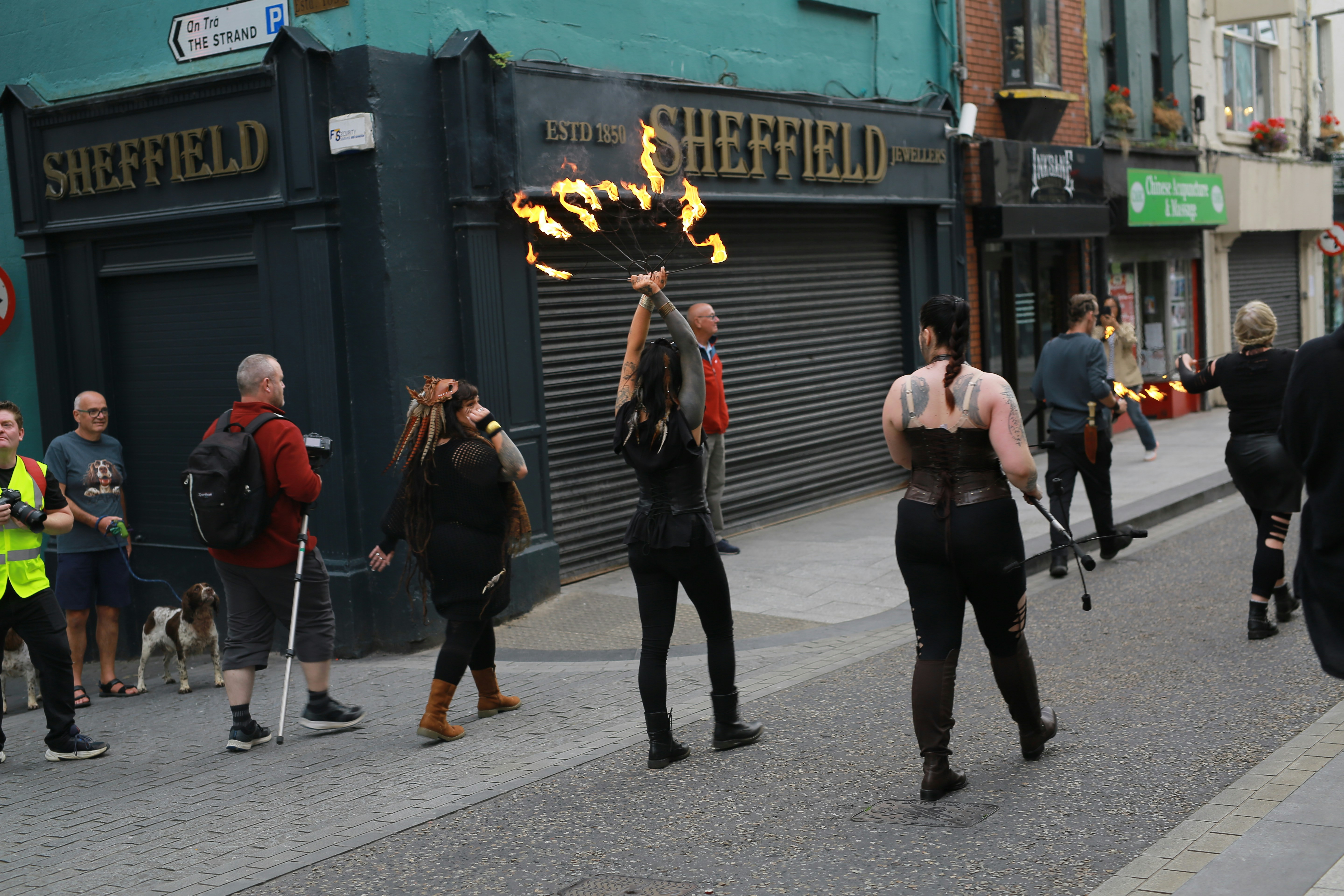 Fire-Show on a Cobblestone Street: Behind the Scenes of a Street Performer Gathering