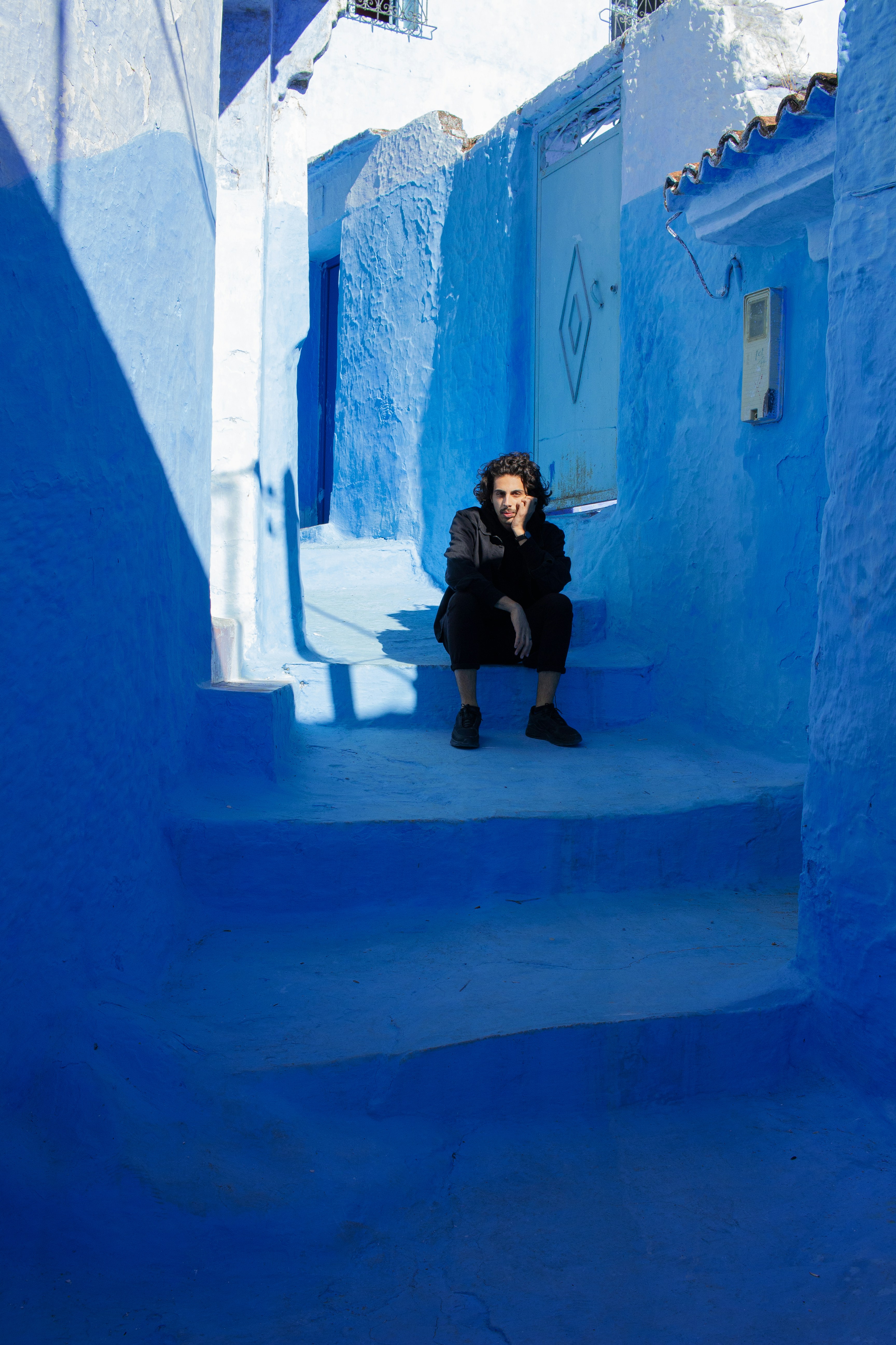Blue Alley Reverie: A Quiet Moment in Cobalt Walls