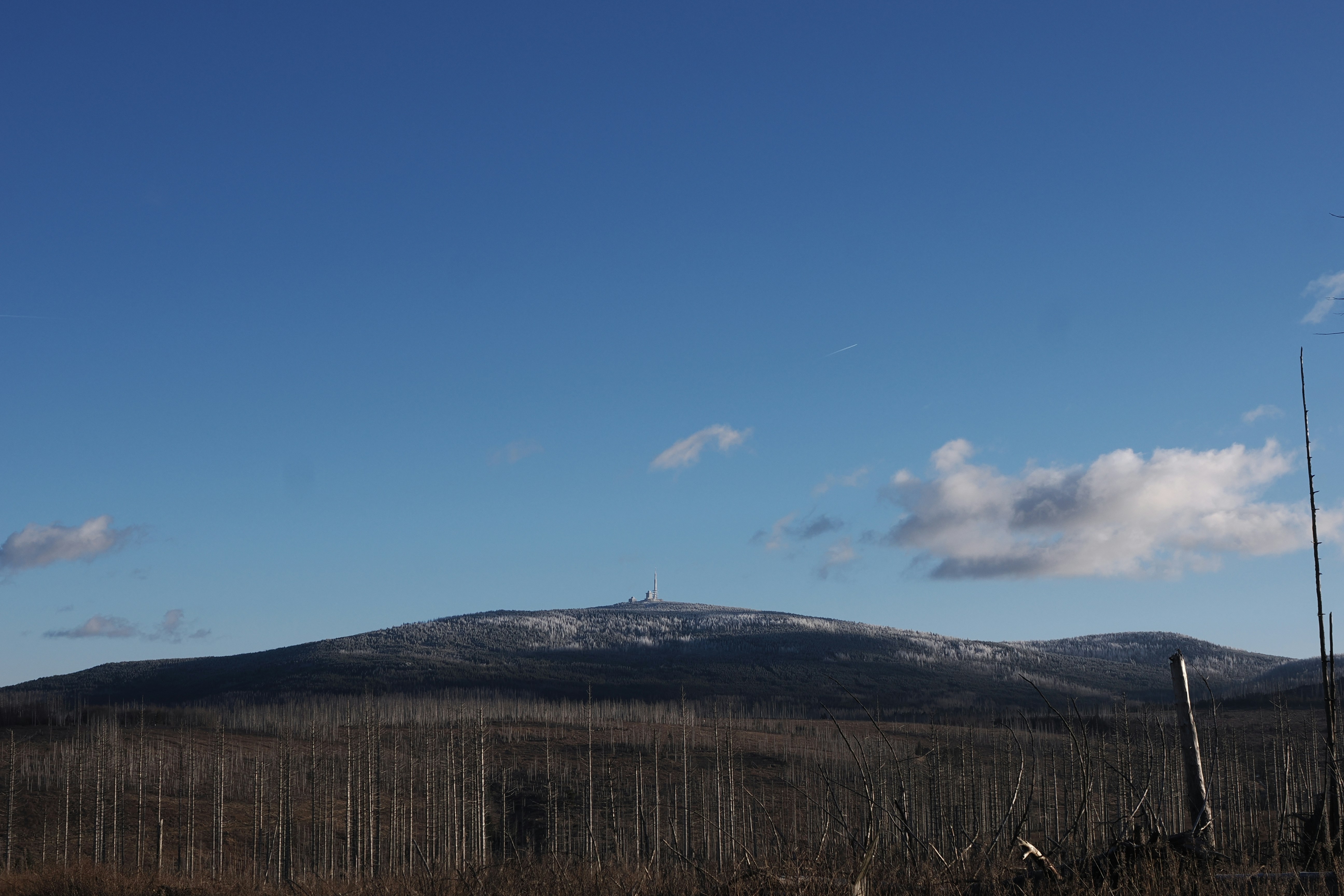 Wide-Open Sky Over Snow-Dusted Ridge