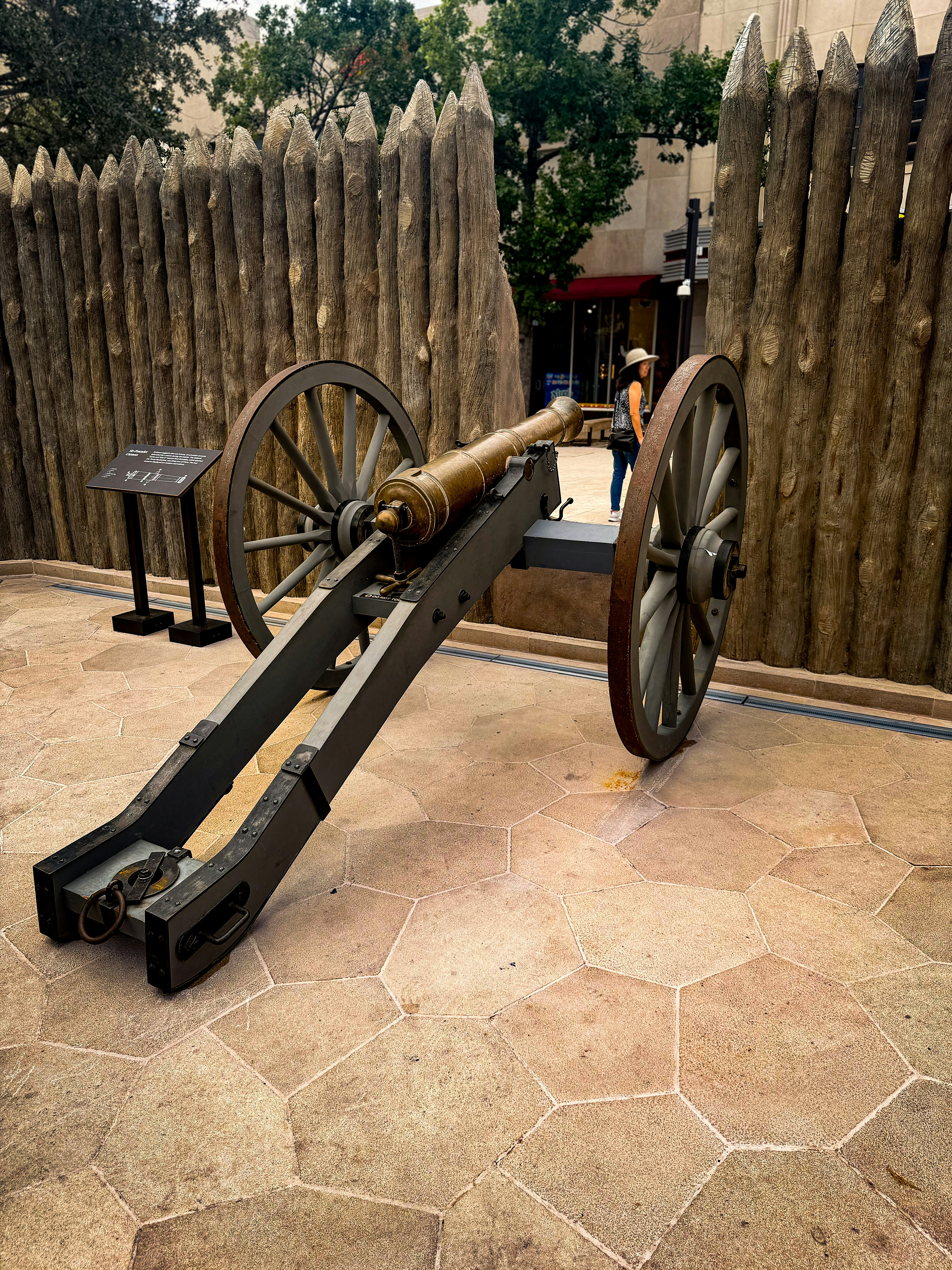 Historic artillery cannon on a sunlit stone plaza