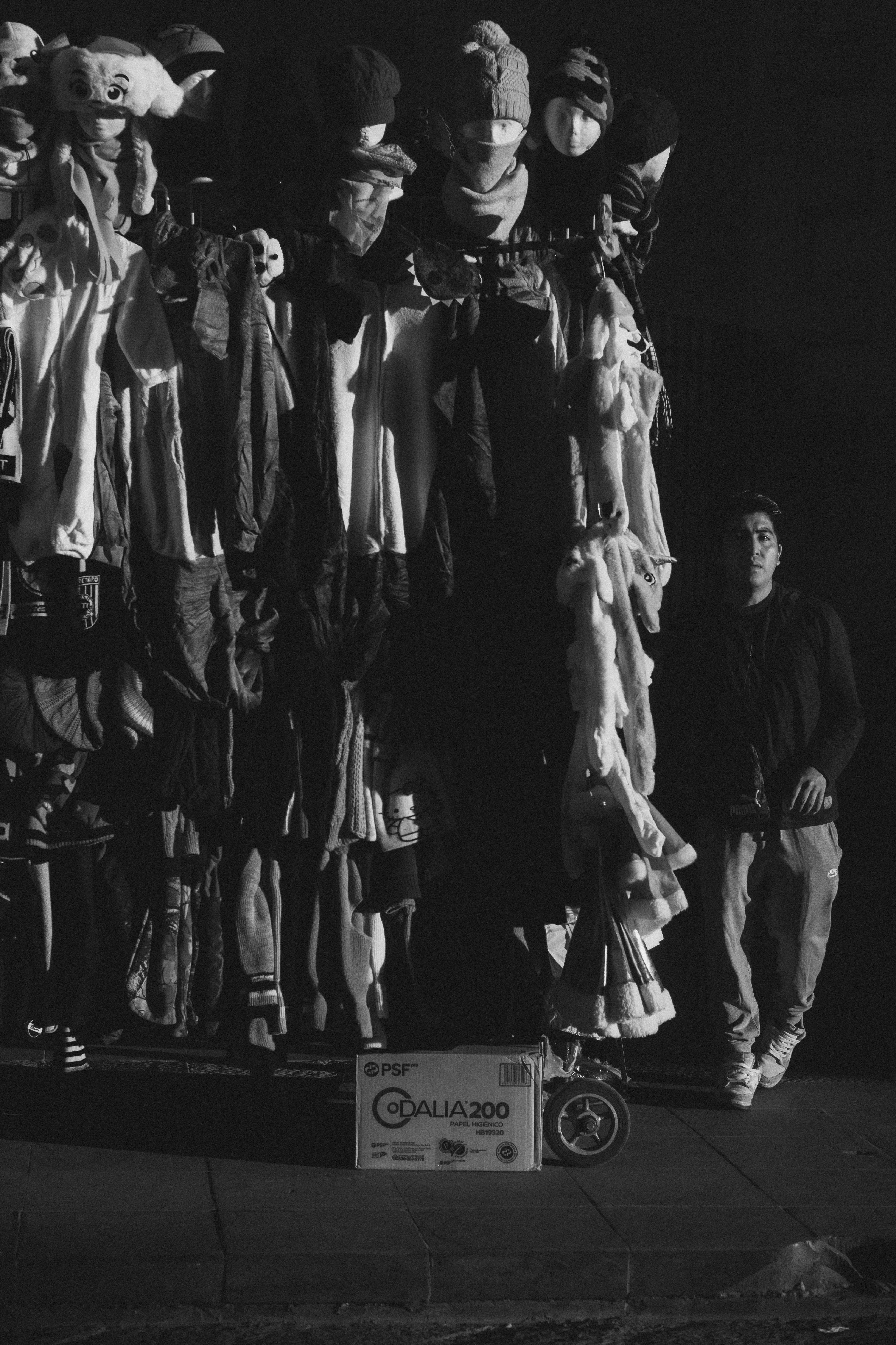 Silhouette of Streetwear Mounds: A Night Market Display