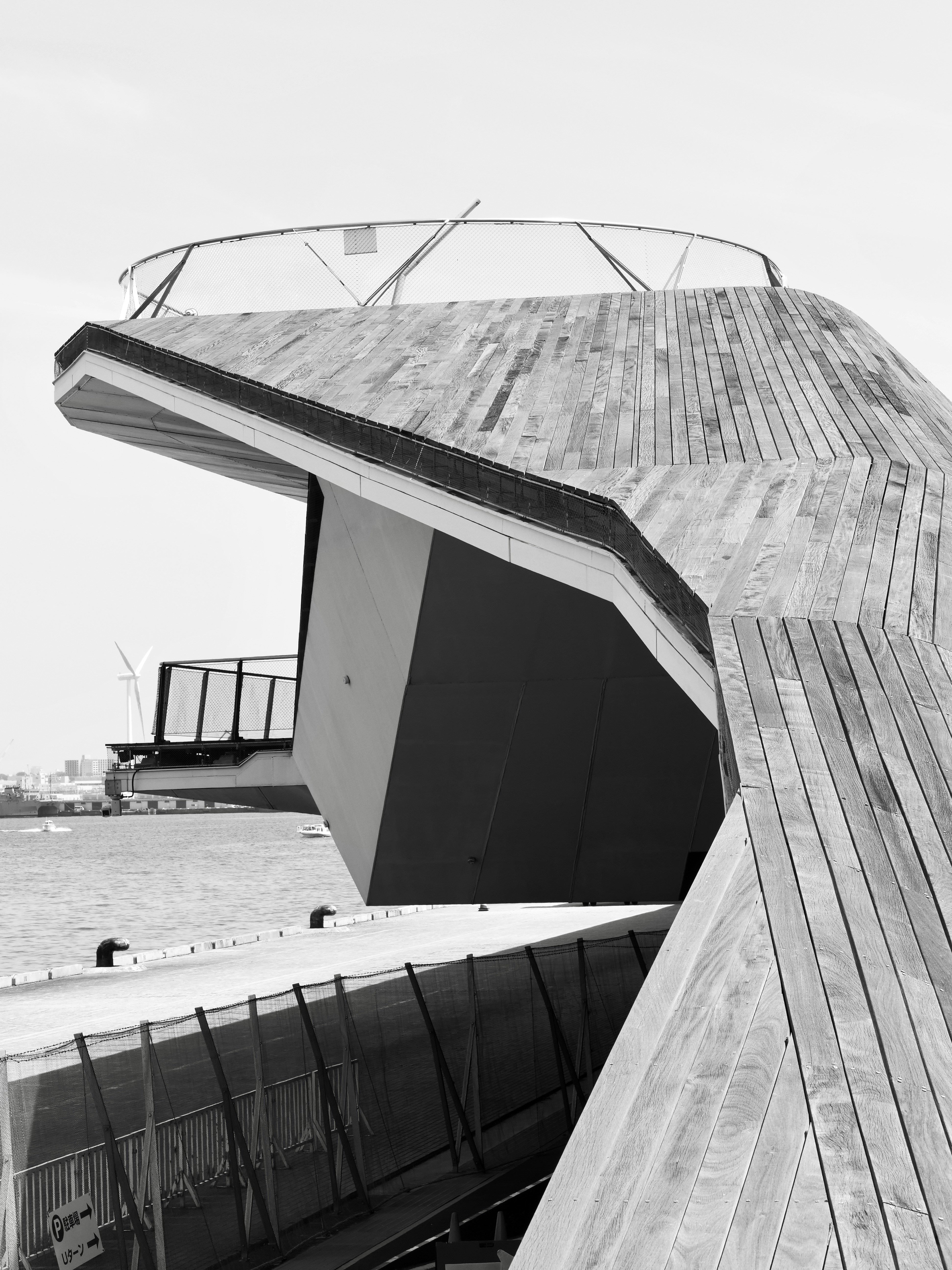 Concrete Angles: A Curved Promenade Reaches Over the Water