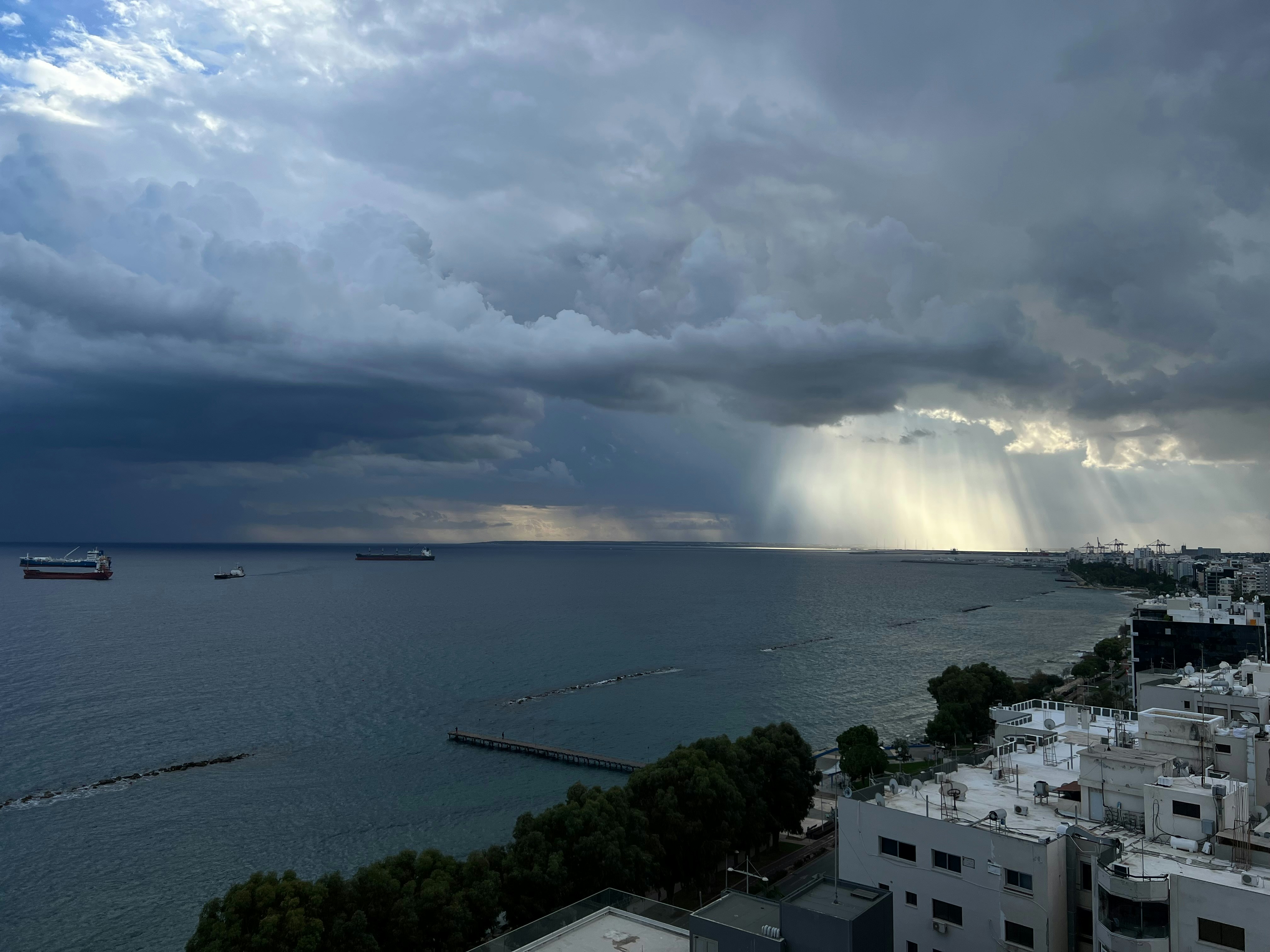 Storm-Edge Horizon Over a Quiet Coastal City