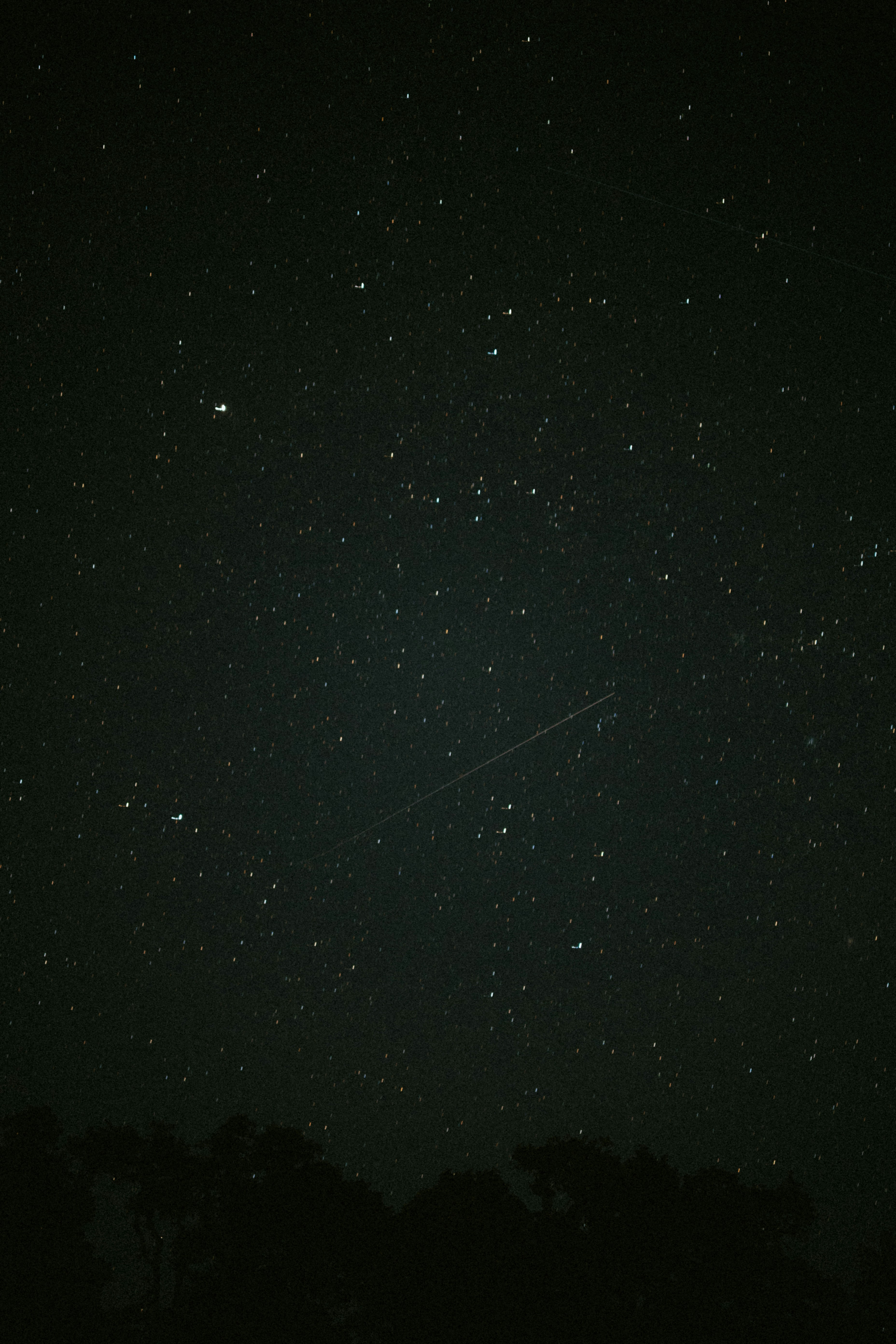 Starfall Trail: A Meteor Skims the Night Sky