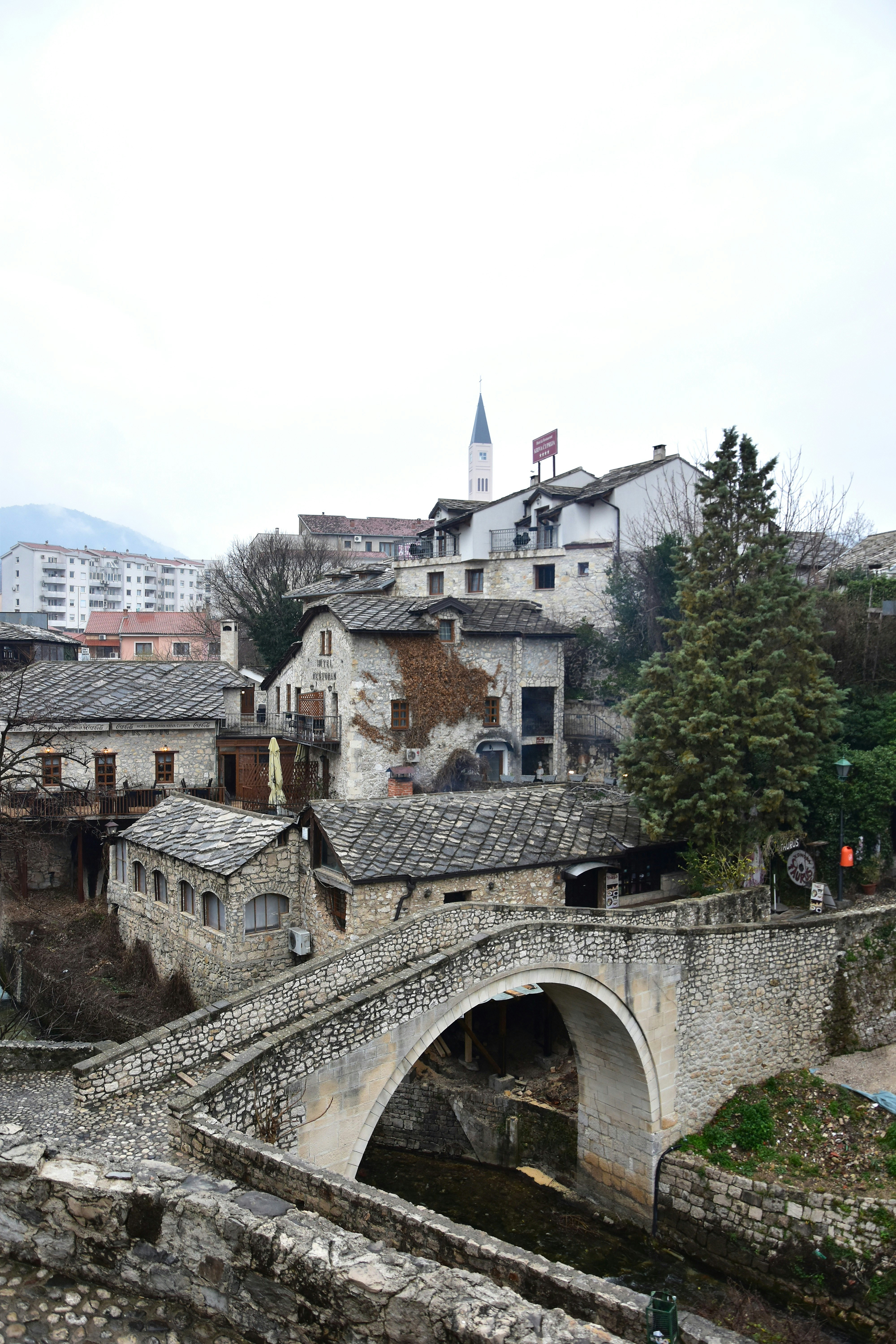Old stone bridge over a river in a european town. photo – Free River ...