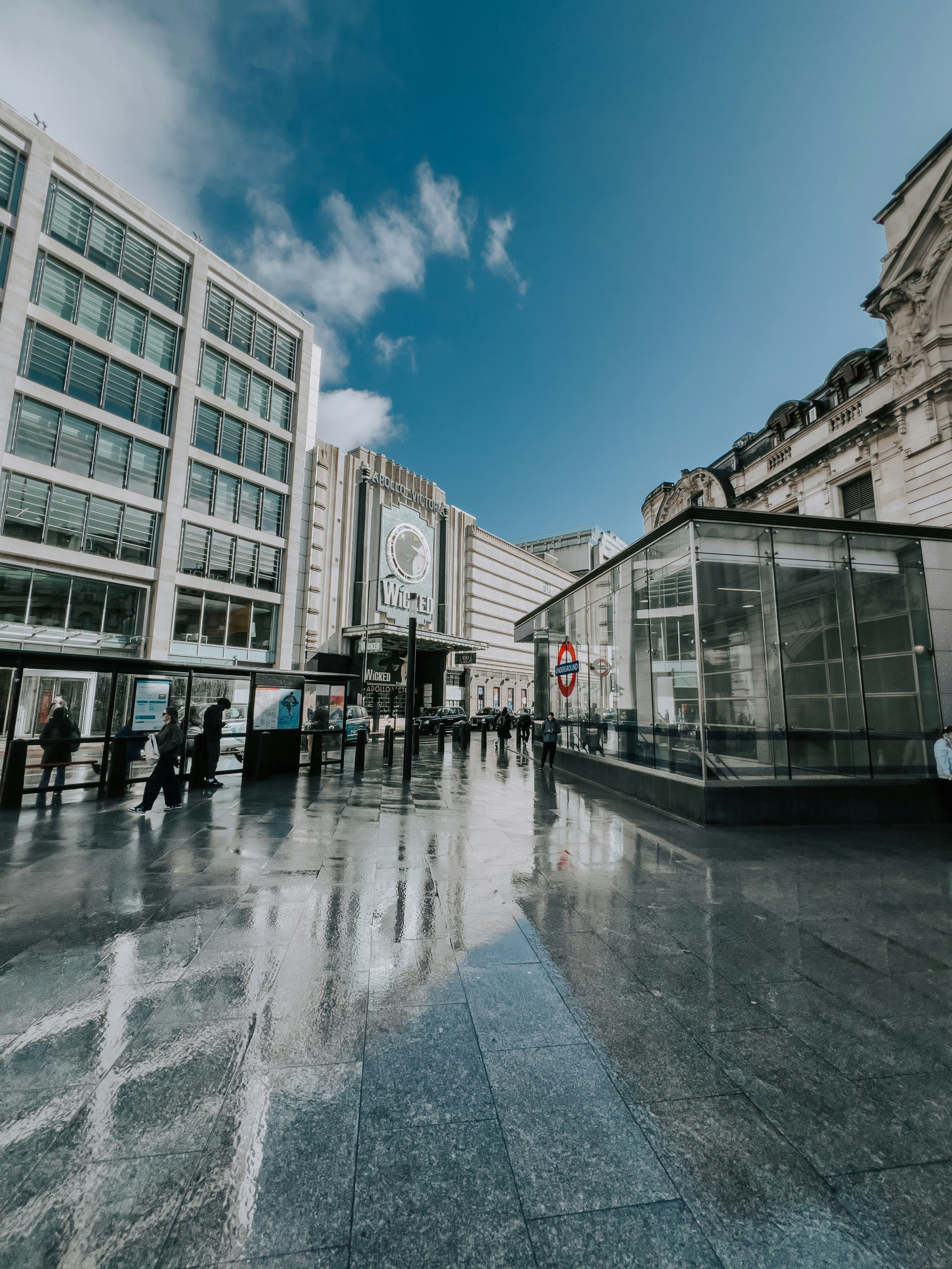 City Square After Rain: Modern Glass Meets Historic Facade