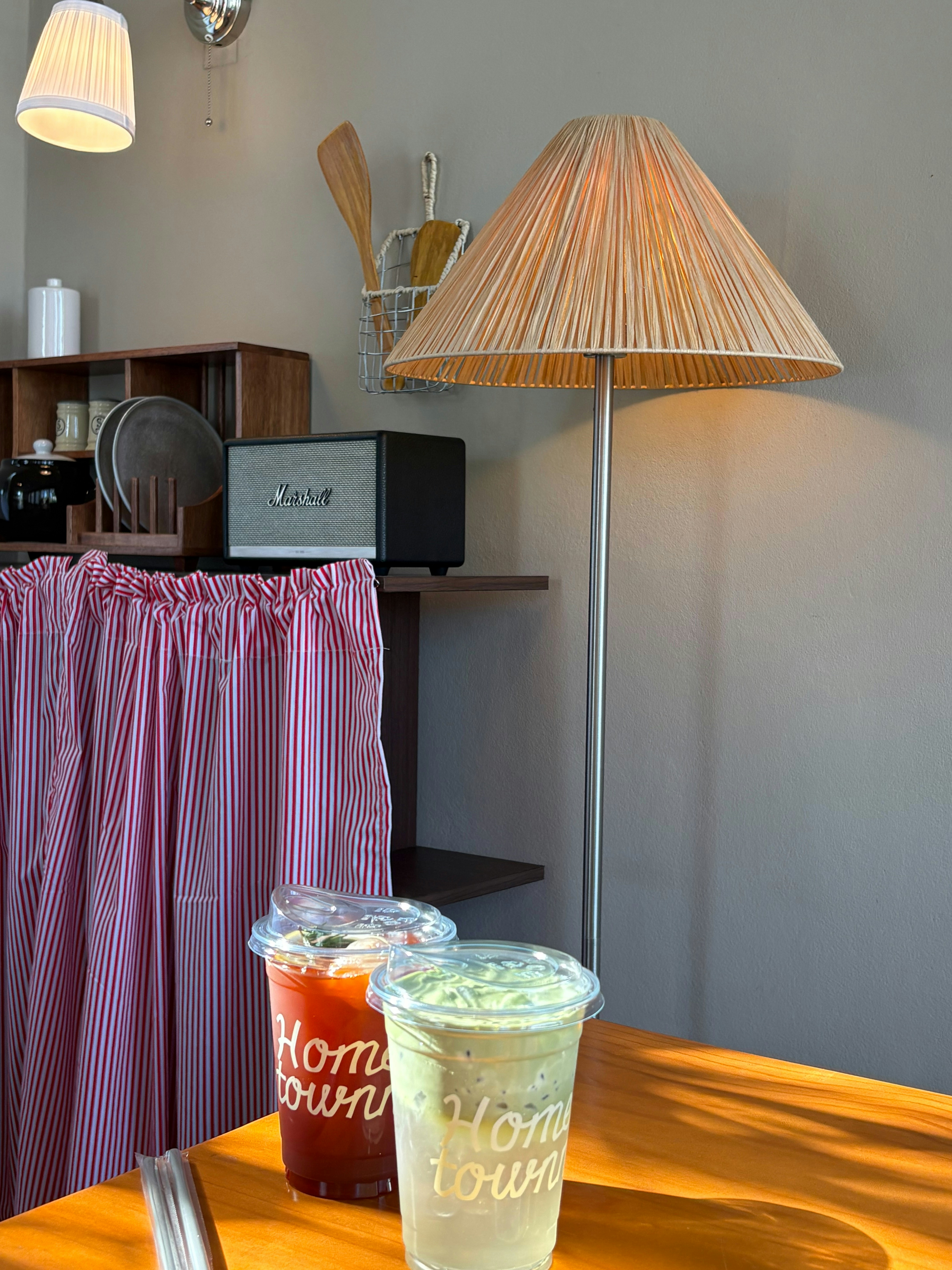 Coffee Shop Nook with Retro Spotlight and Two Glasses on a Wooden Table