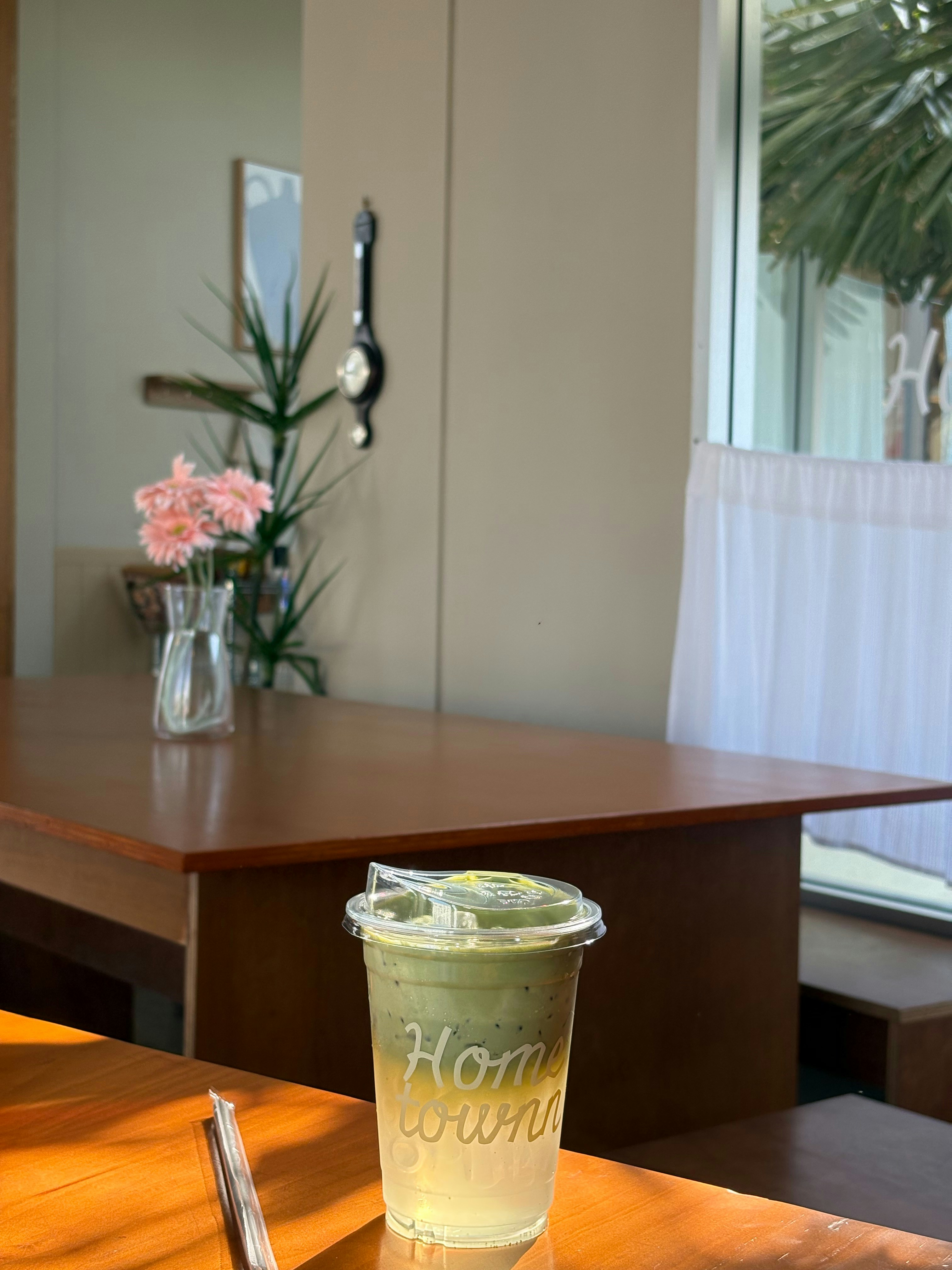 Green Smoothie in a Café with a Soft Pastel Interior