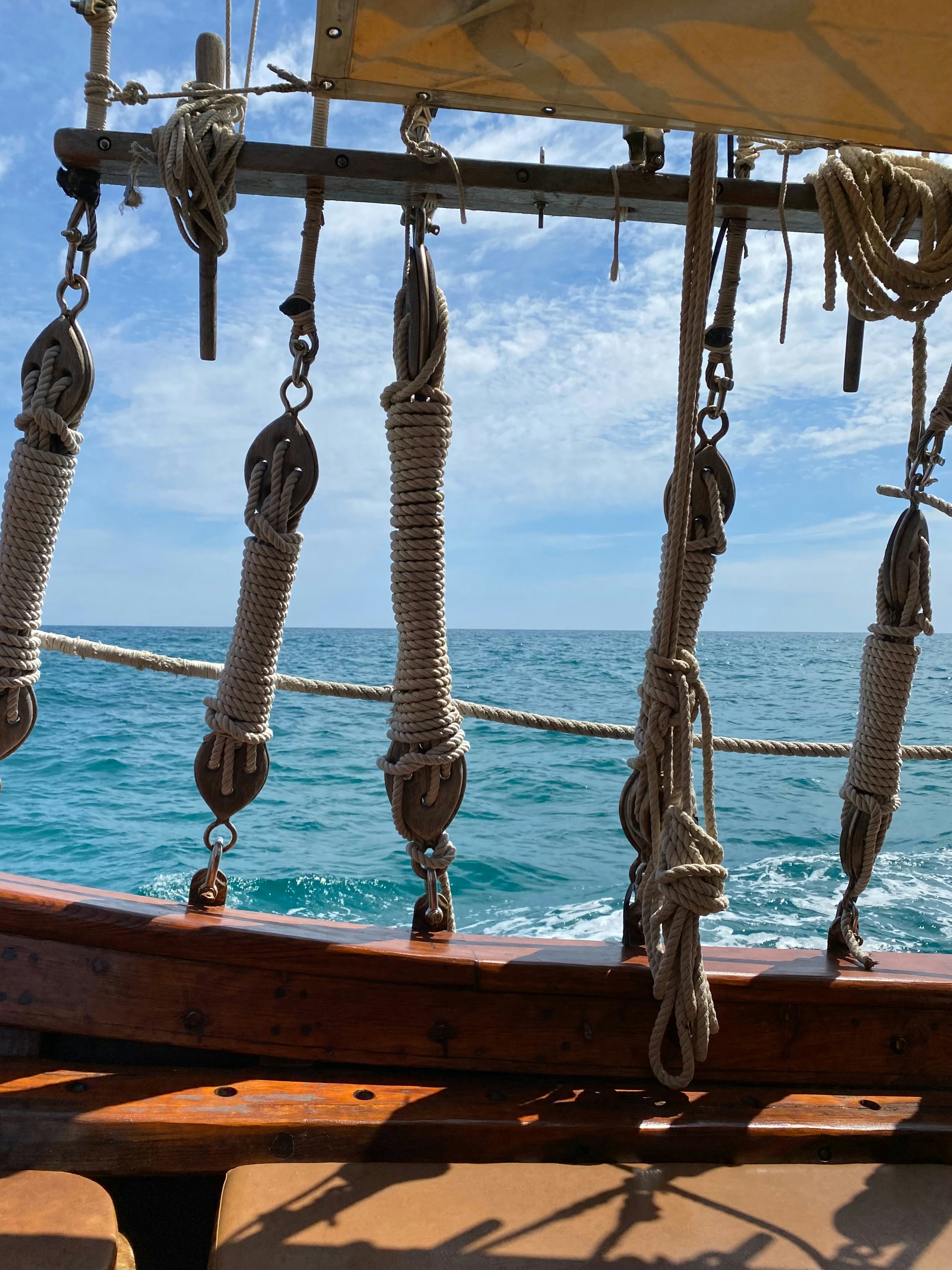 Rope and Sea: A Sailboat’s Quiet Tangle at Midday