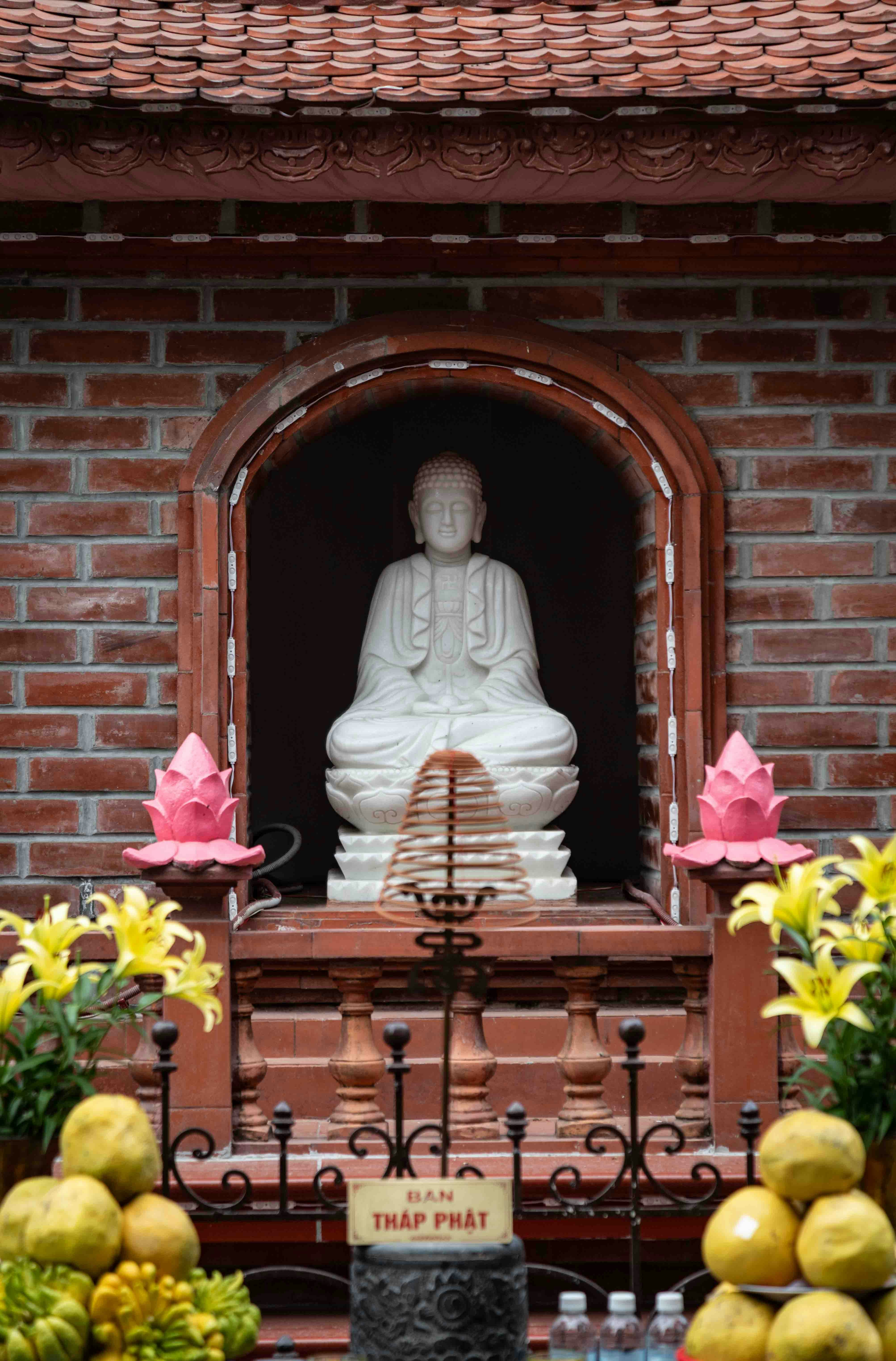 Silent Bodhisattva Guarded by Orange Lanterns and Altar Offerings