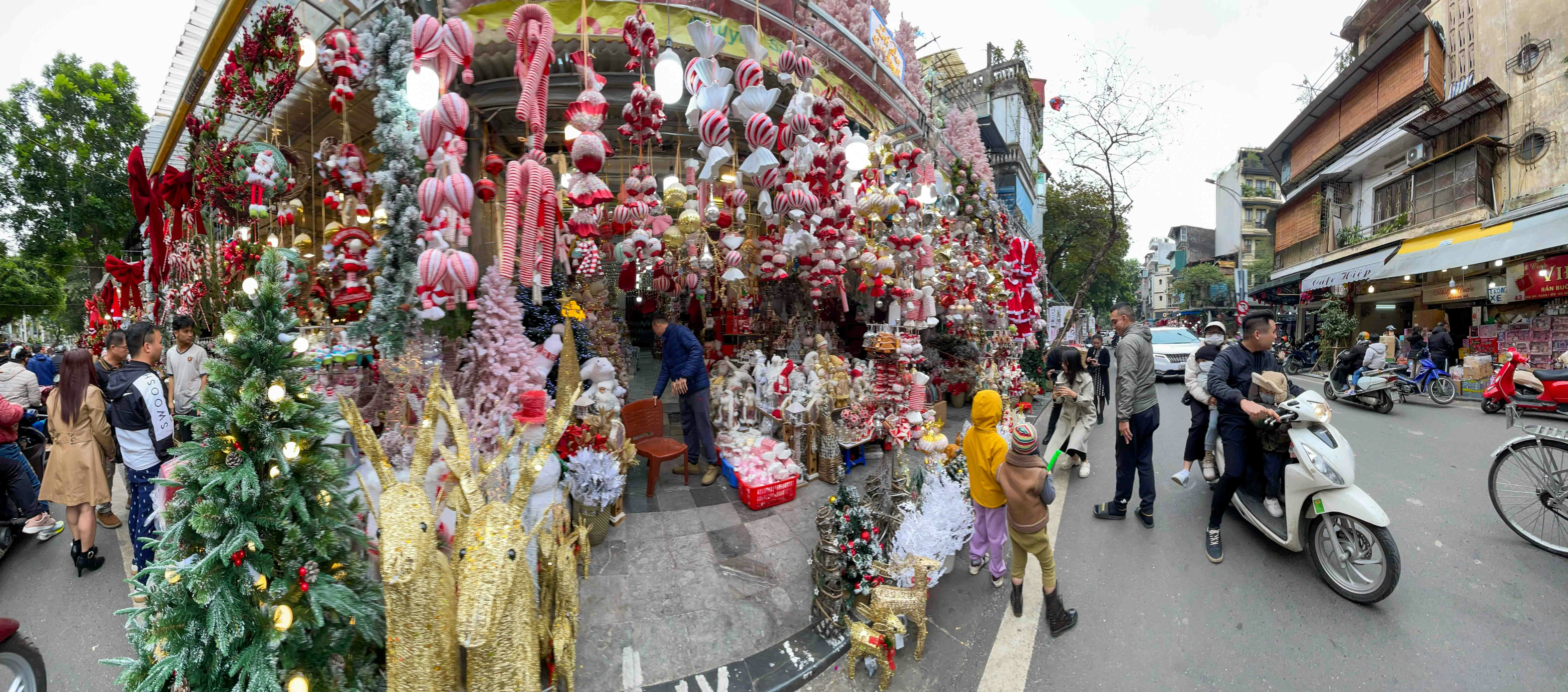 Market Lanterns and Festive Ornaments Along a Bustling Street