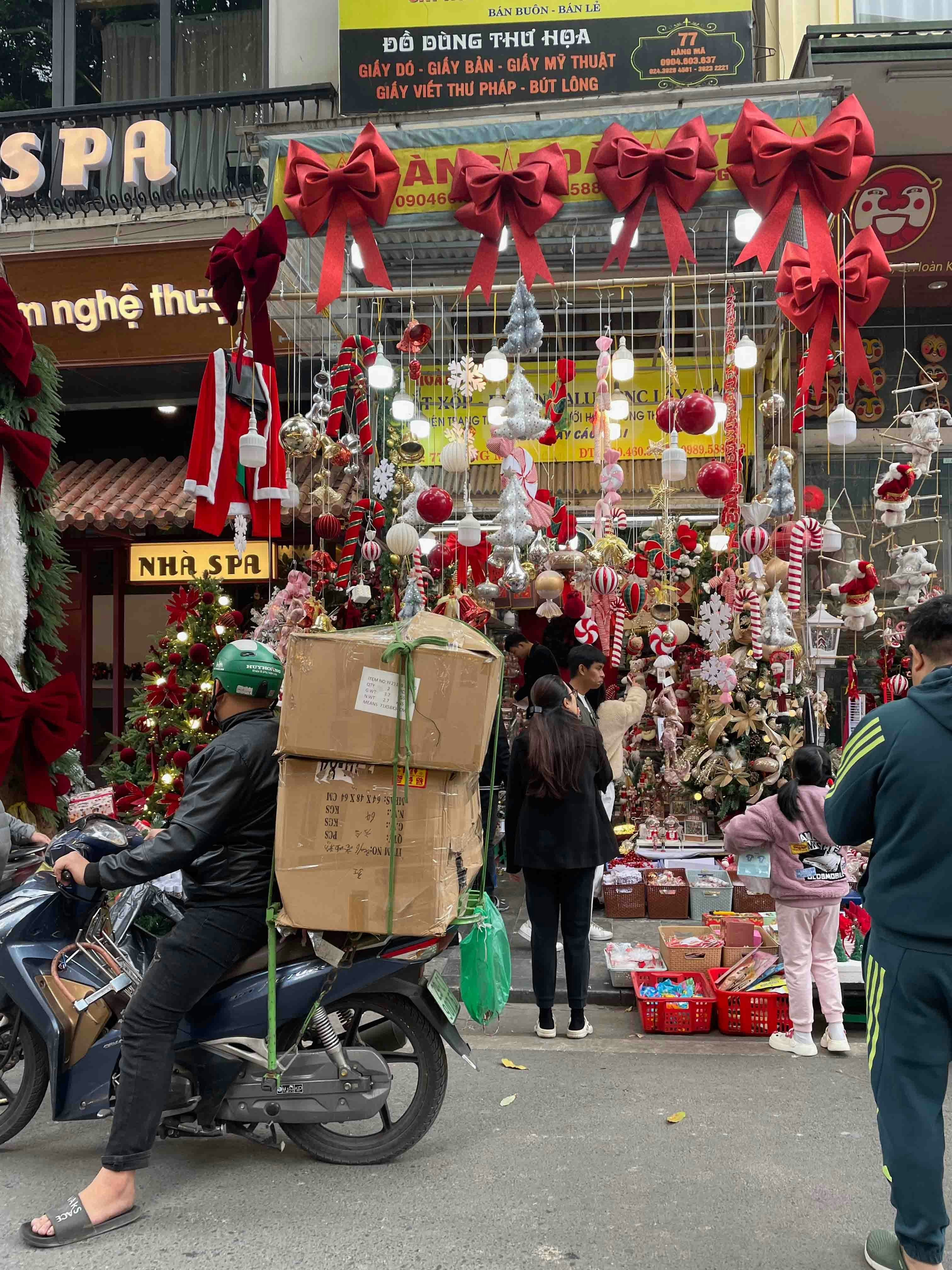 Street vendor selling christmas decorations and gifts.