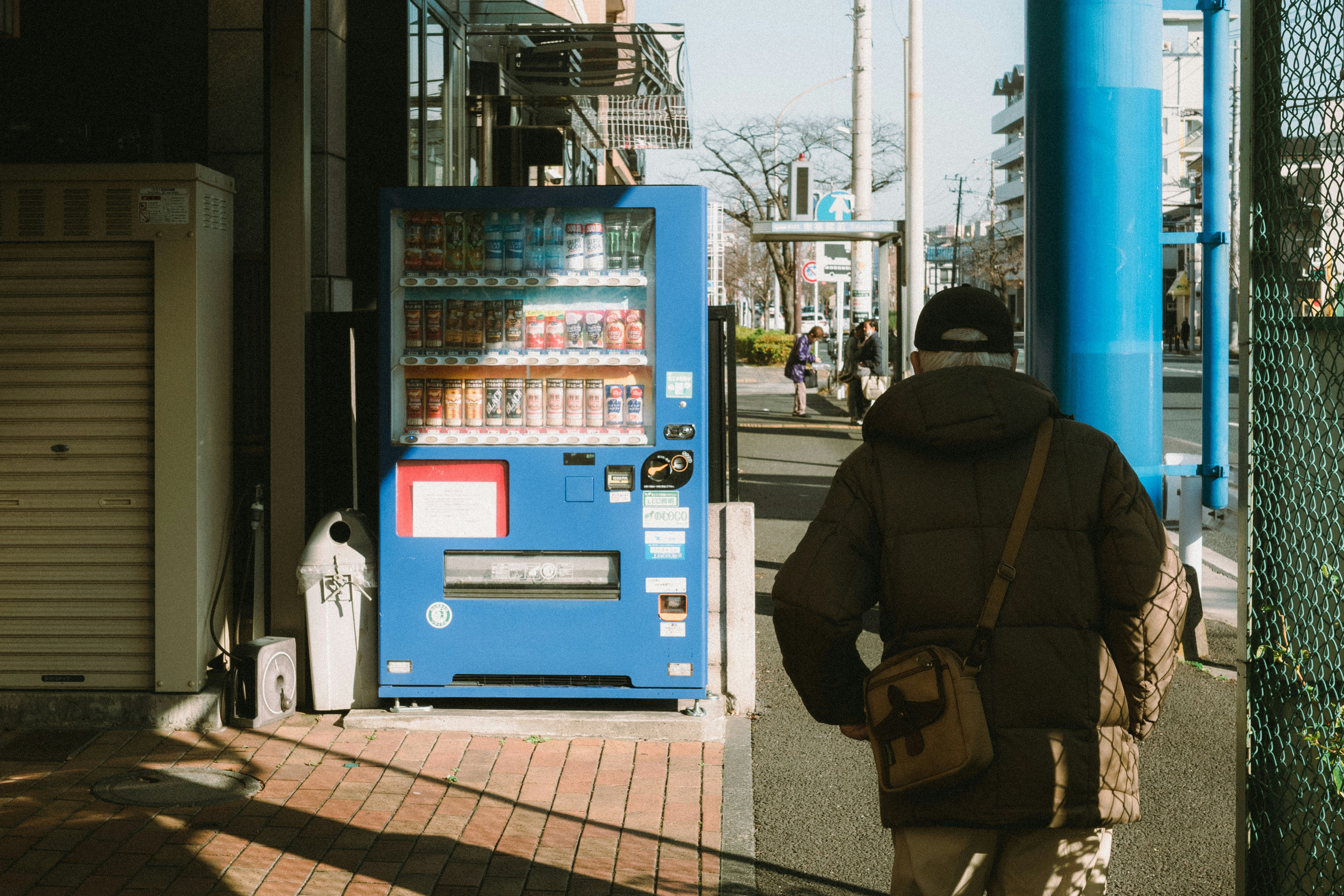 Blue Vending Portal on a Quiet City Walk