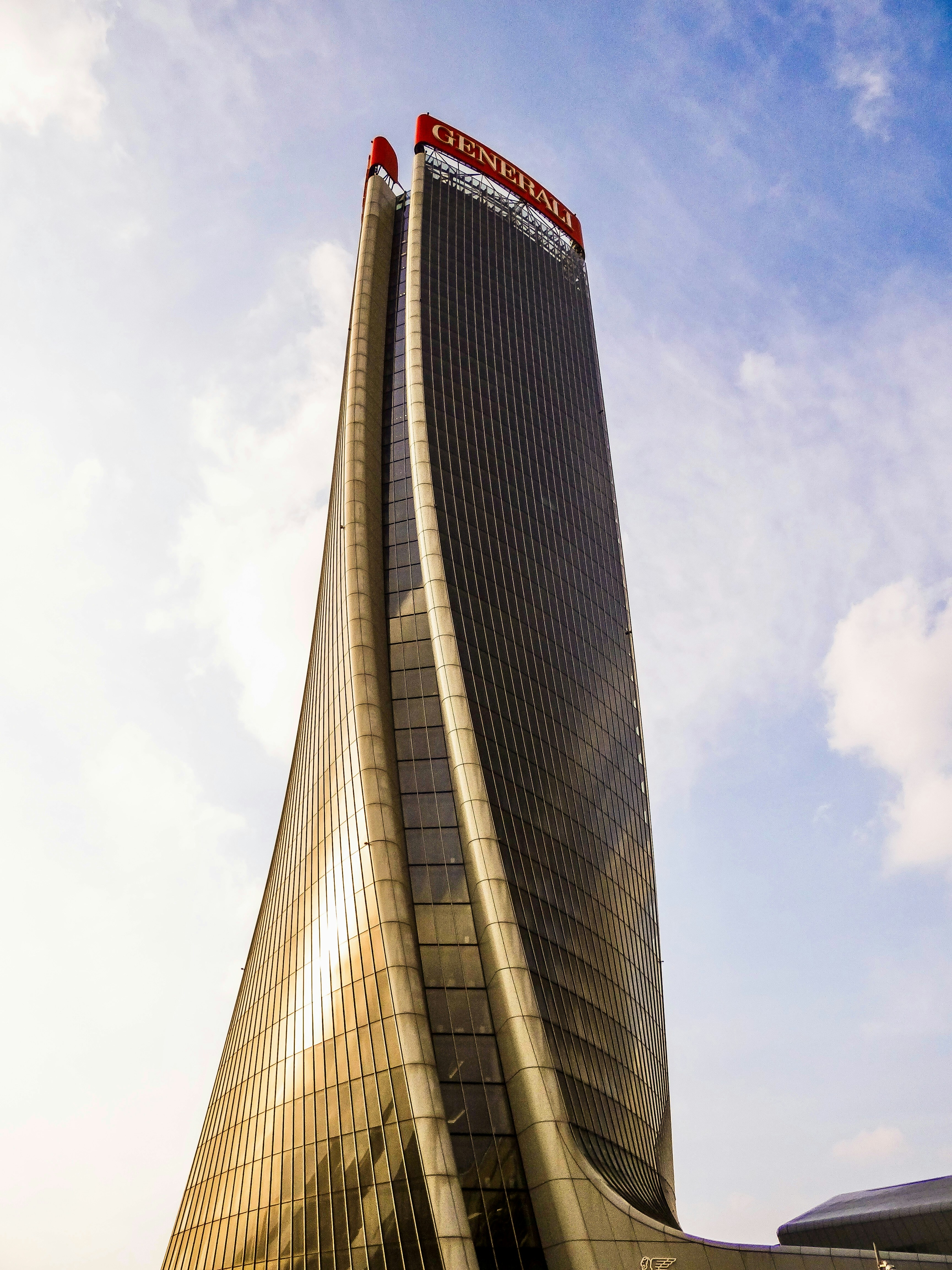 Giant Capstone: The Gherkin’s Skyward Slope in Golden Light