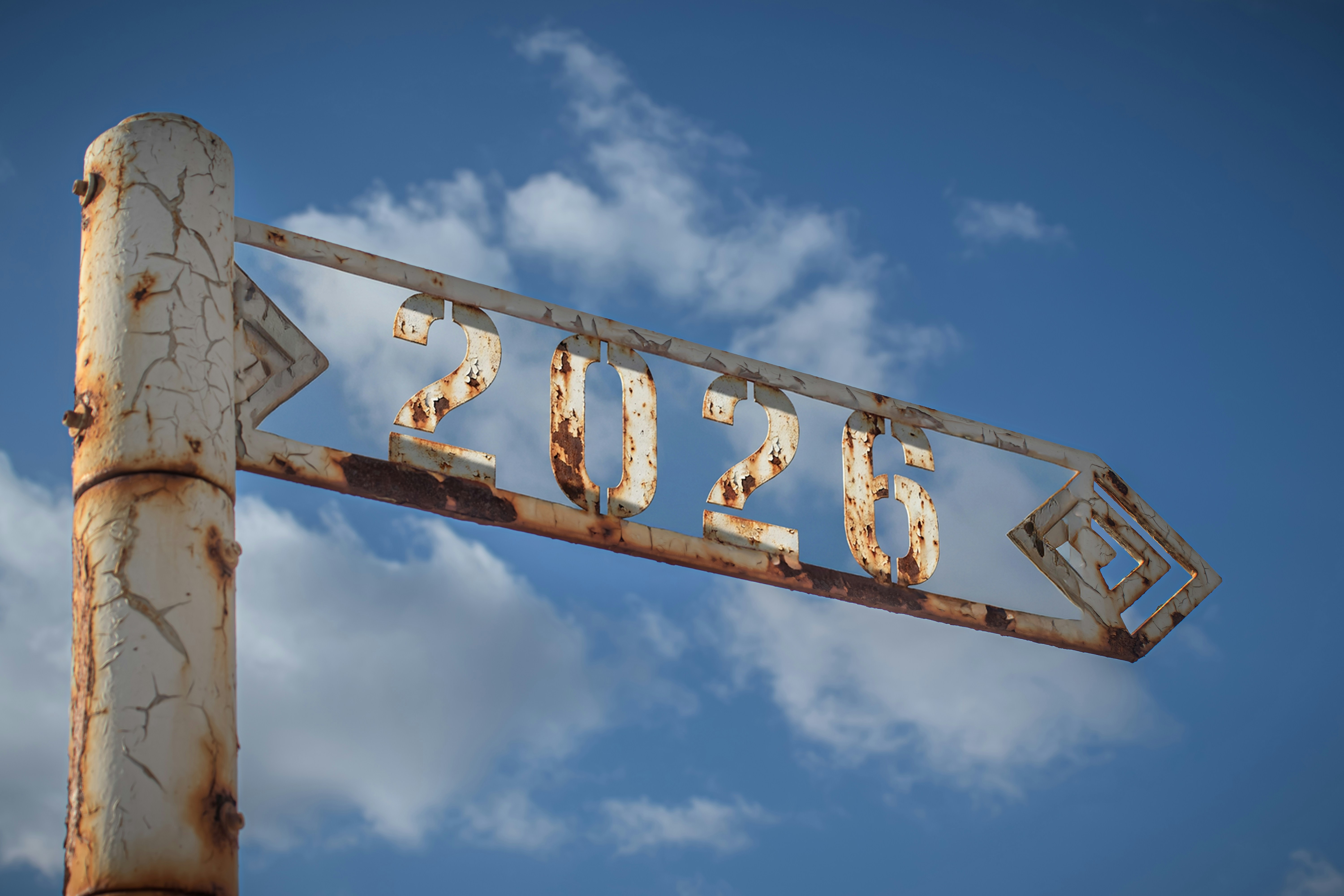 Rusting Road Sign Points to 2026