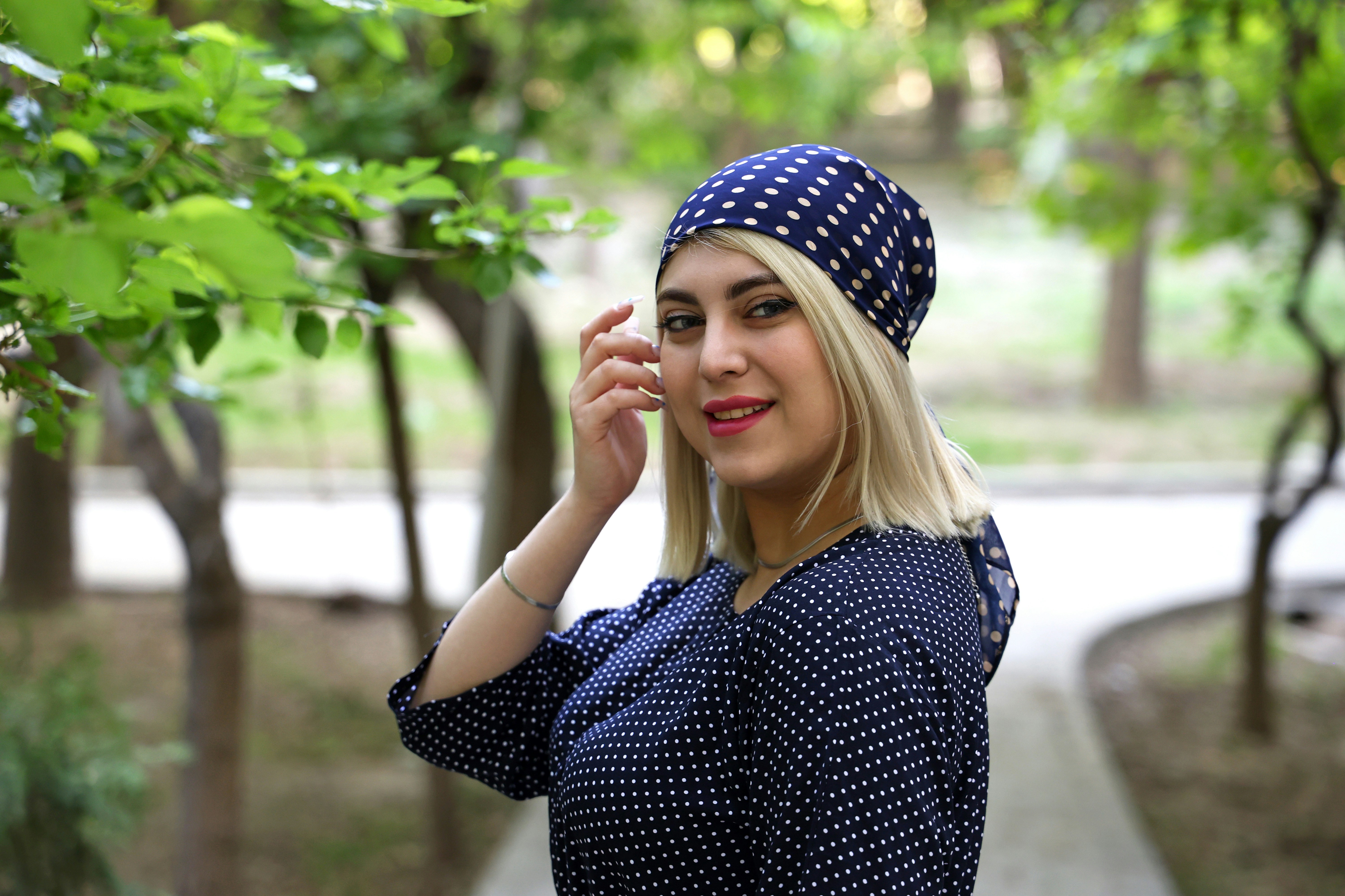 Polished portrait in a sunlit grove