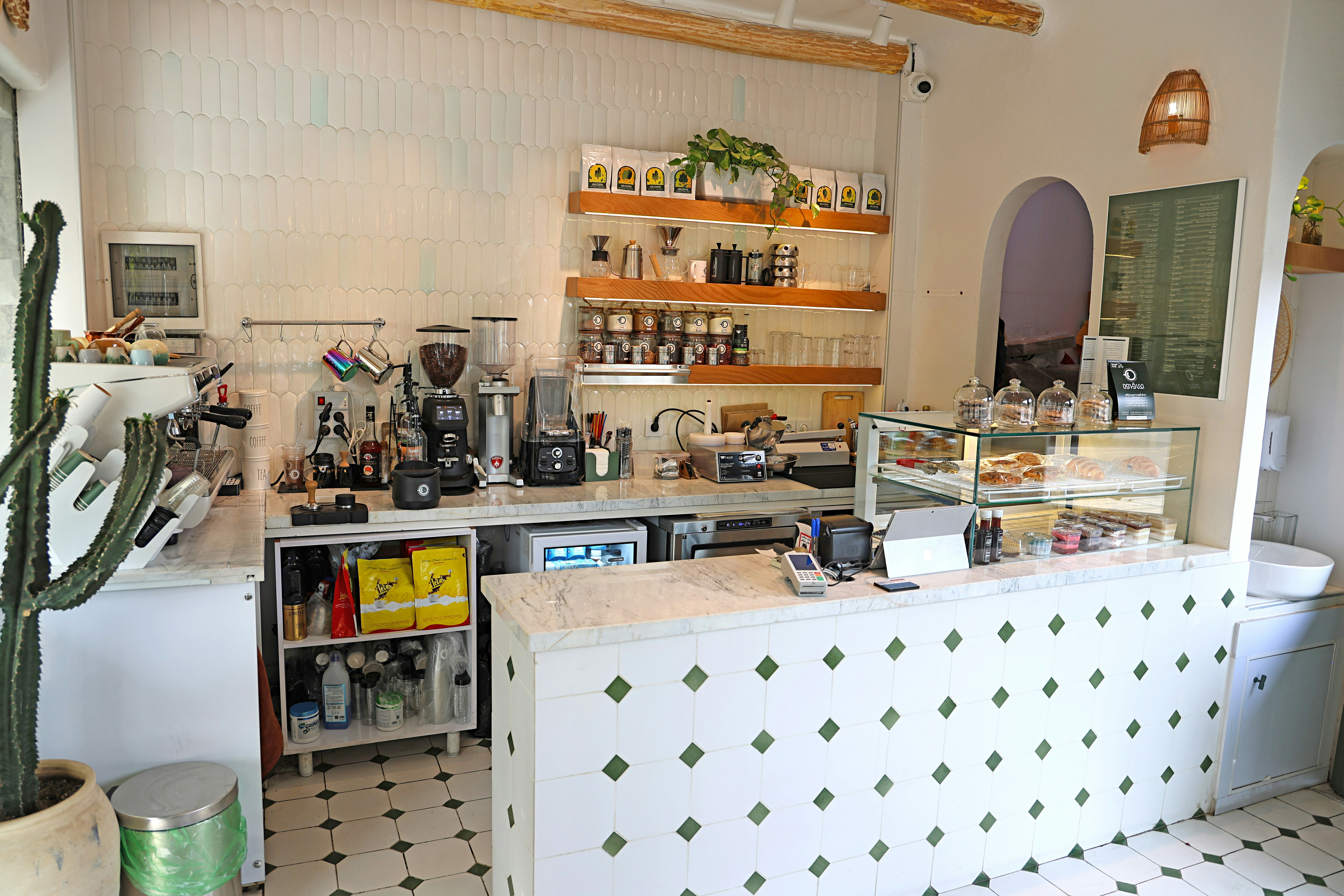 Bright Café Counter with Minimalist Tilework and Fresh Ingredients on Display