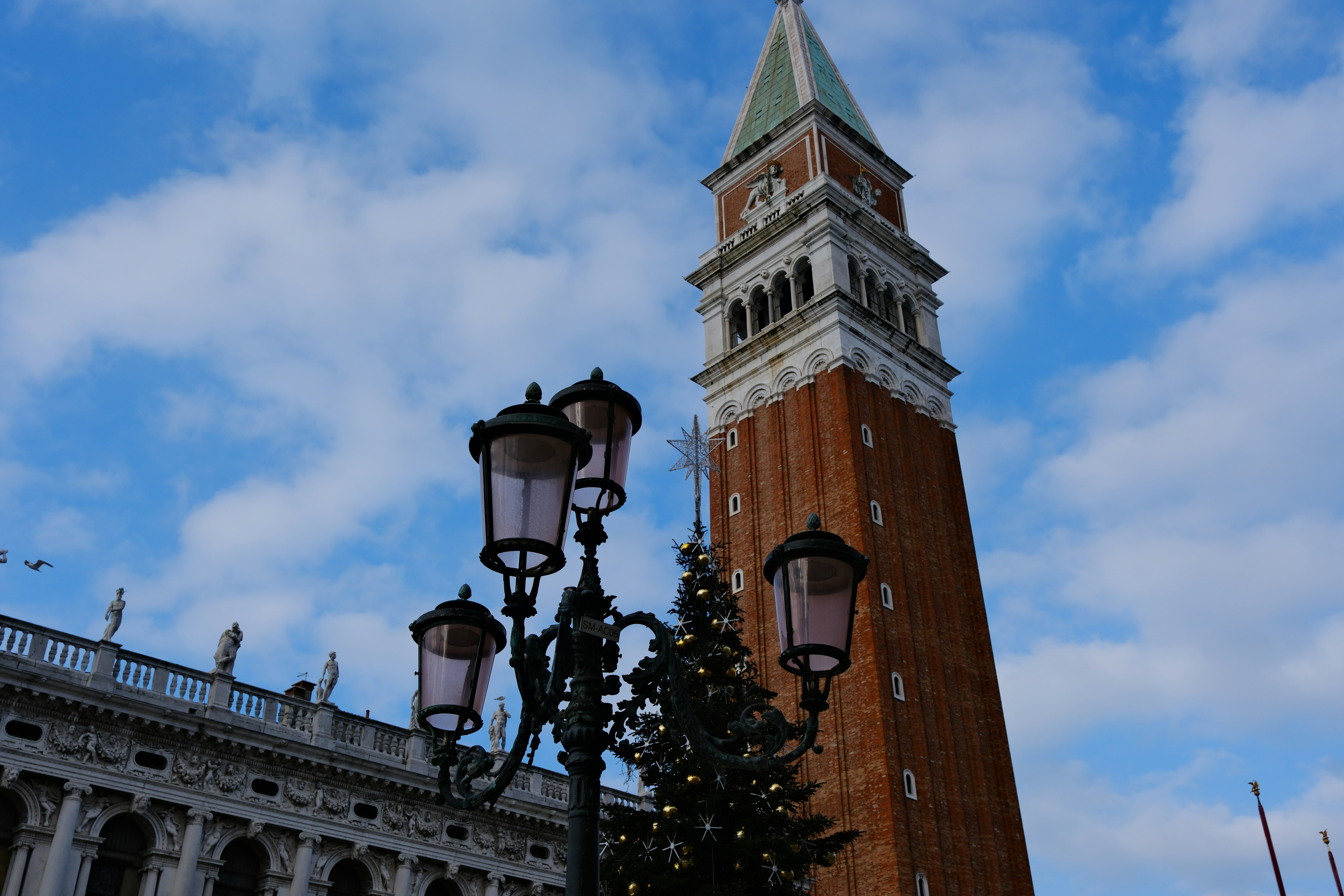 Bell Tower and Lanterns: A Venetian Corner under Blue Skies