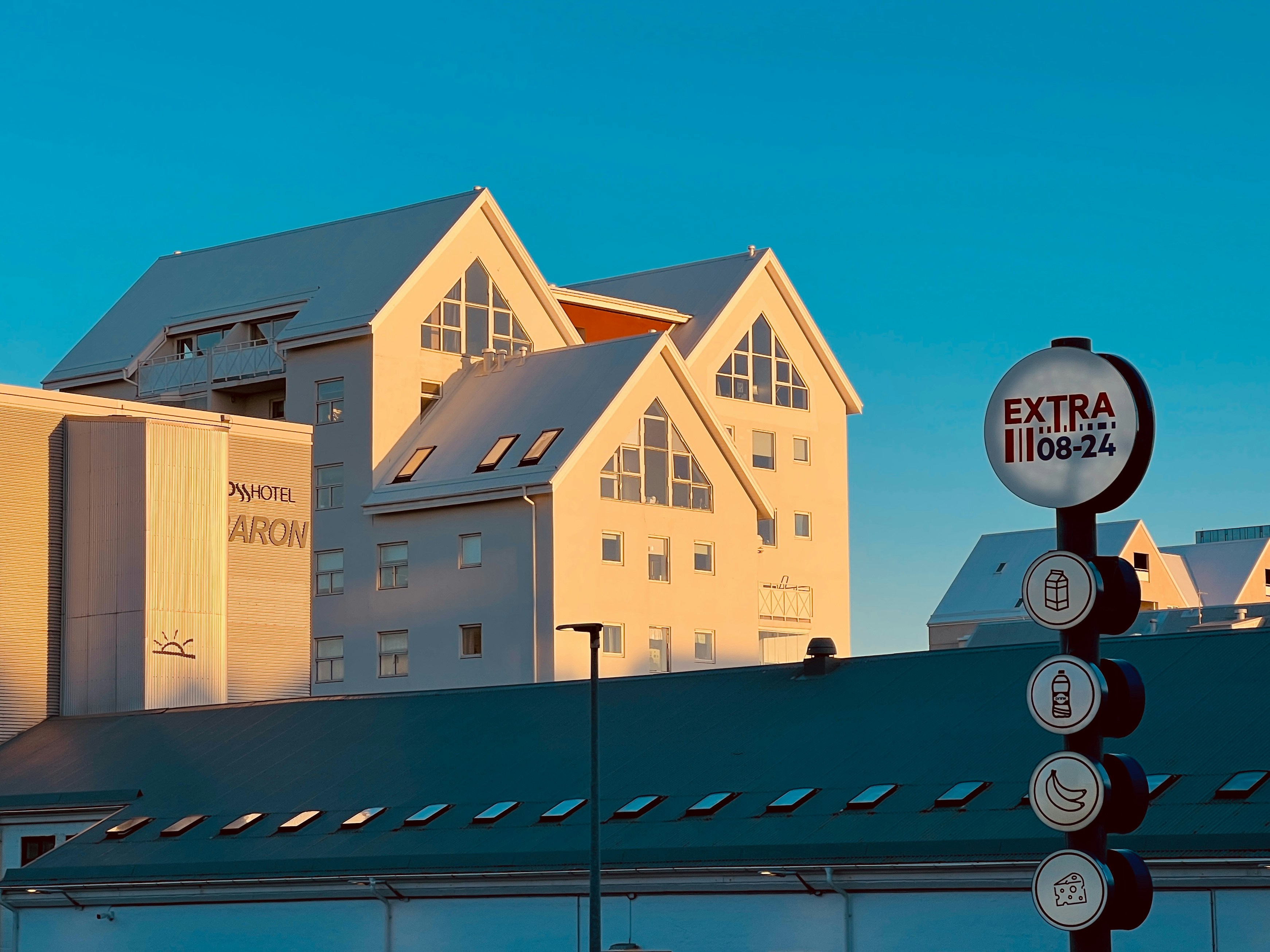Sunlit gables: a quiet architectural skyline at golden hour