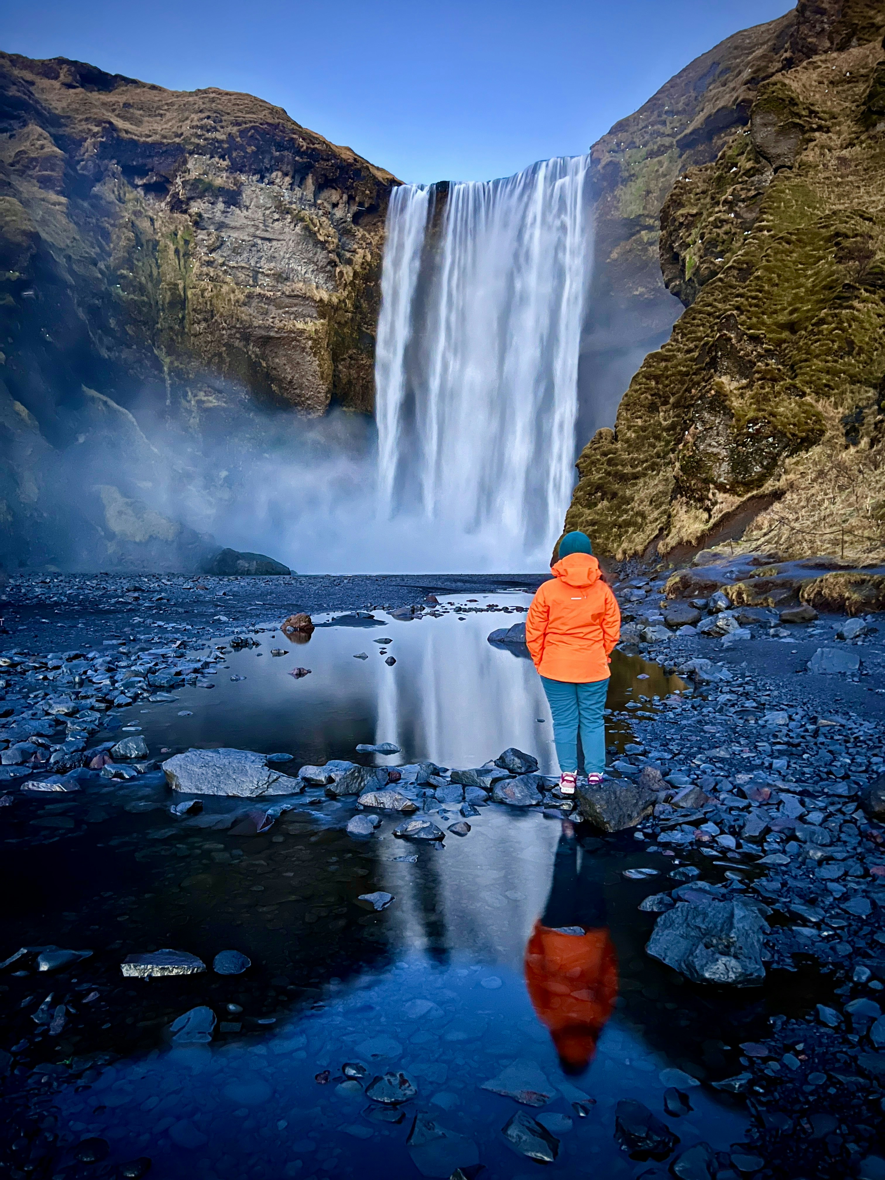 Brassica Falls: A Vibrant Visitor by the Mist-Blue Gorge