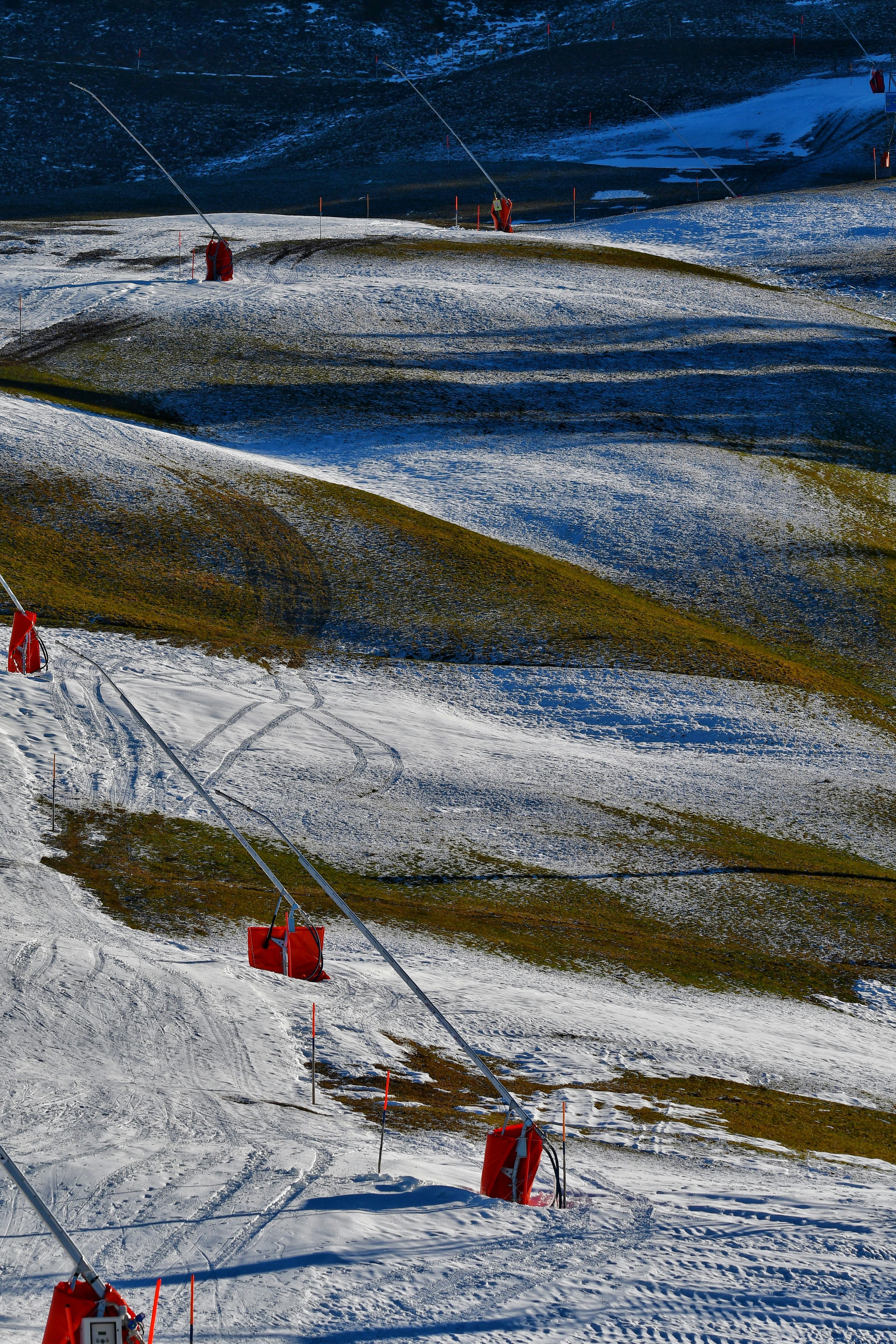 Red Cushions Tie the Snow-Lined Slope to a Daring Ski Lift