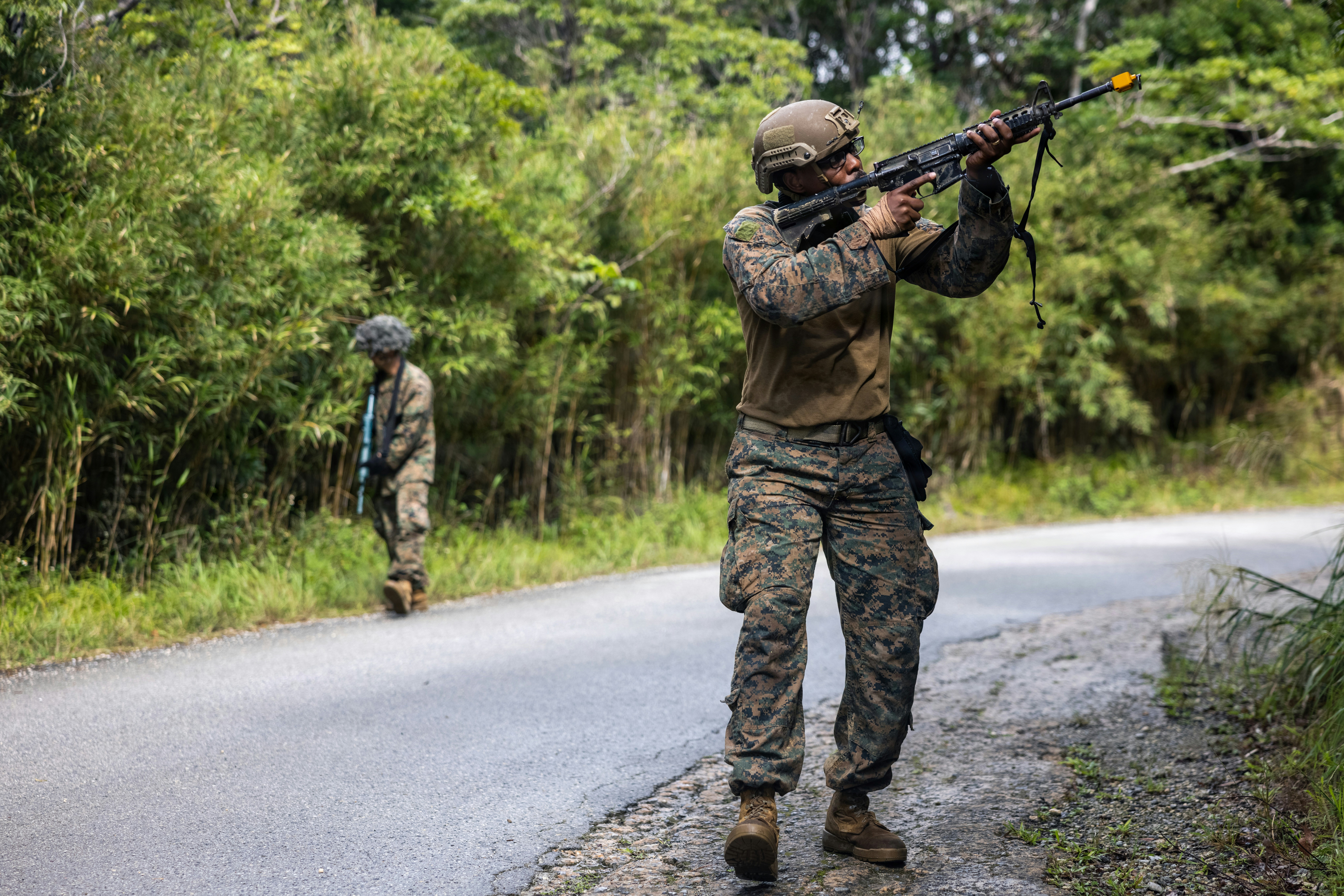 U.S. Navy Hospital Corpsmen throughout III Marine Expeditionary Force conduct a patrol during the Jungle Medicine course at the Jungle Warfare Training Center, Okinawa, Japan, Oct. 29, 2025. The 10-day medical course trains Navy medical personnel assigned to Marine forces on jungle survival skills, patient tracking, field medical care, and casualty evacuation techniques. (U.S. Marine Corps photo by Cpl. Joaquin Dela Torre)