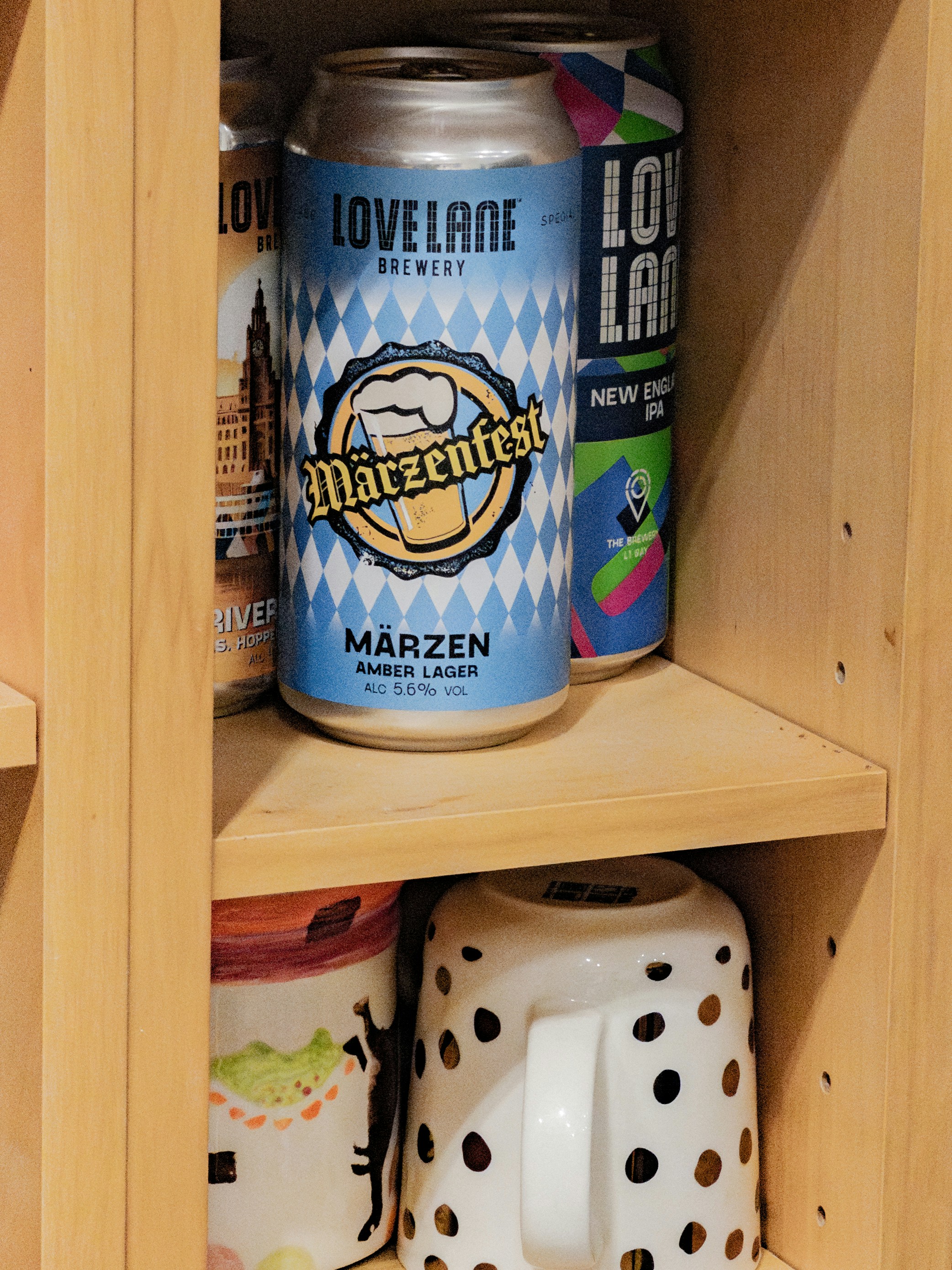Blue Märzen Amid Wooden Shelves