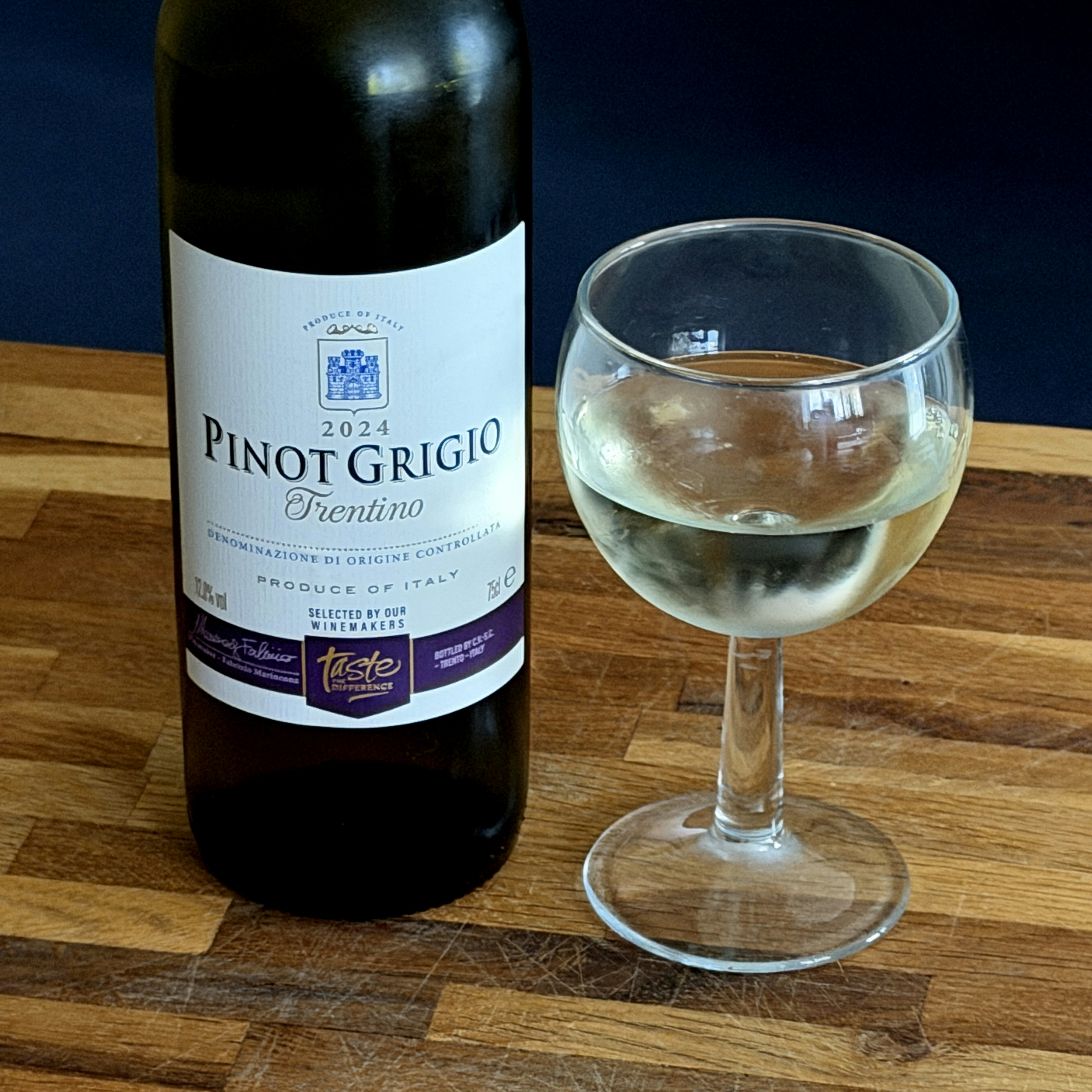 Pinot in Focus: Glass, Bottle, and Wood in Quiet Harmony