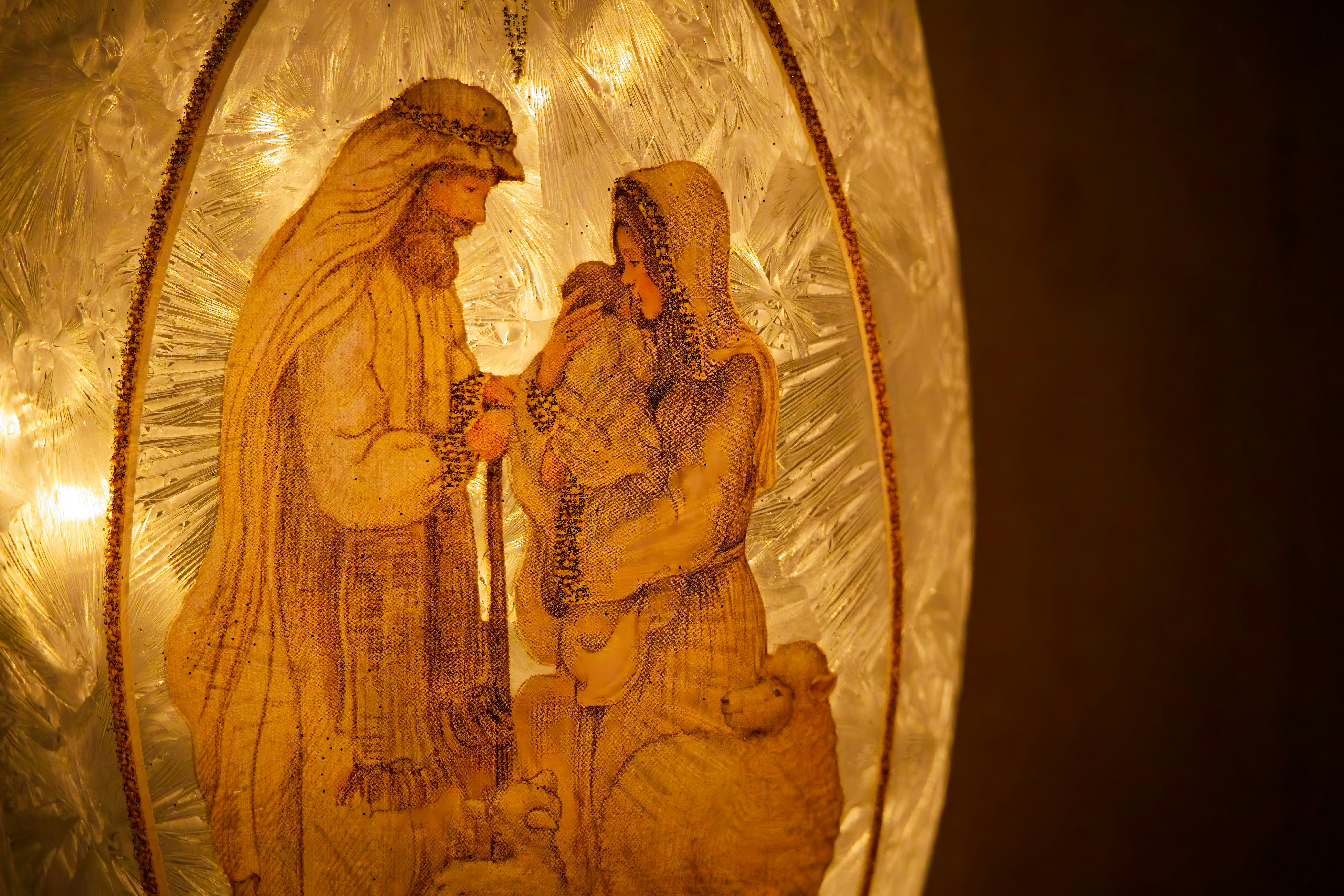 Amber-lit Nativity Within a Glass Inset