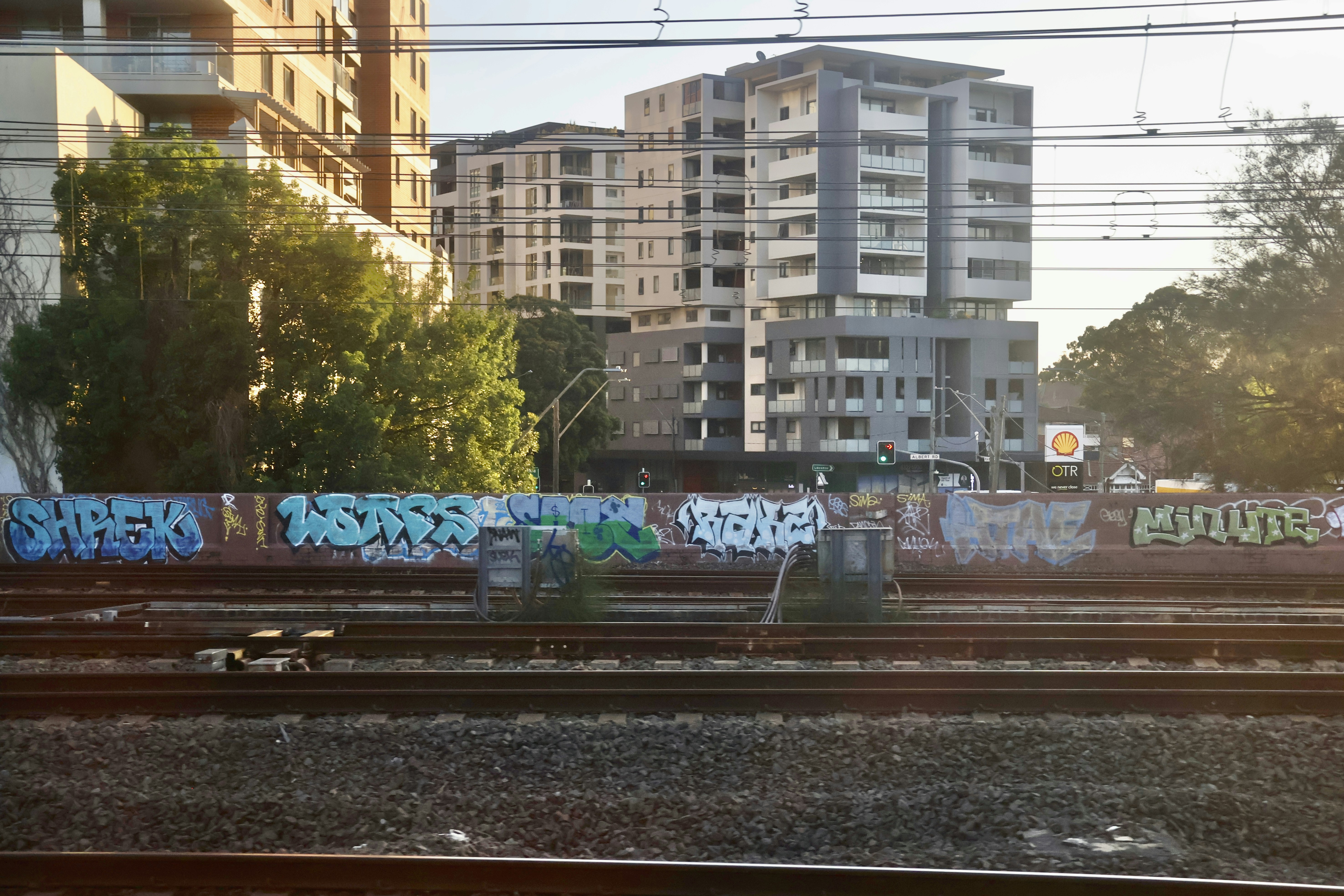 Graffiti Rhythm Over Rails at Dusk