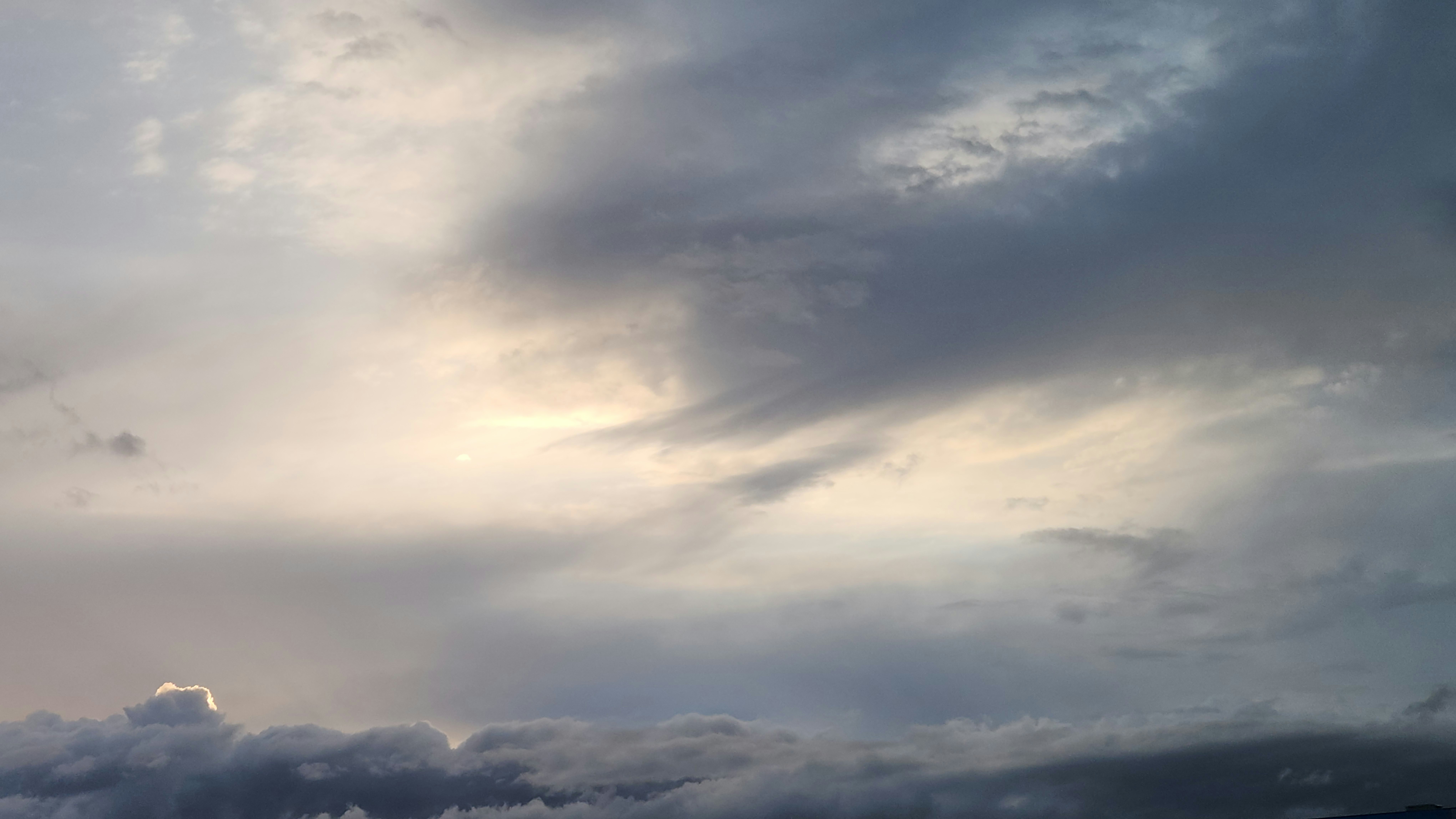Dramatic clouds with sunlight breaking through