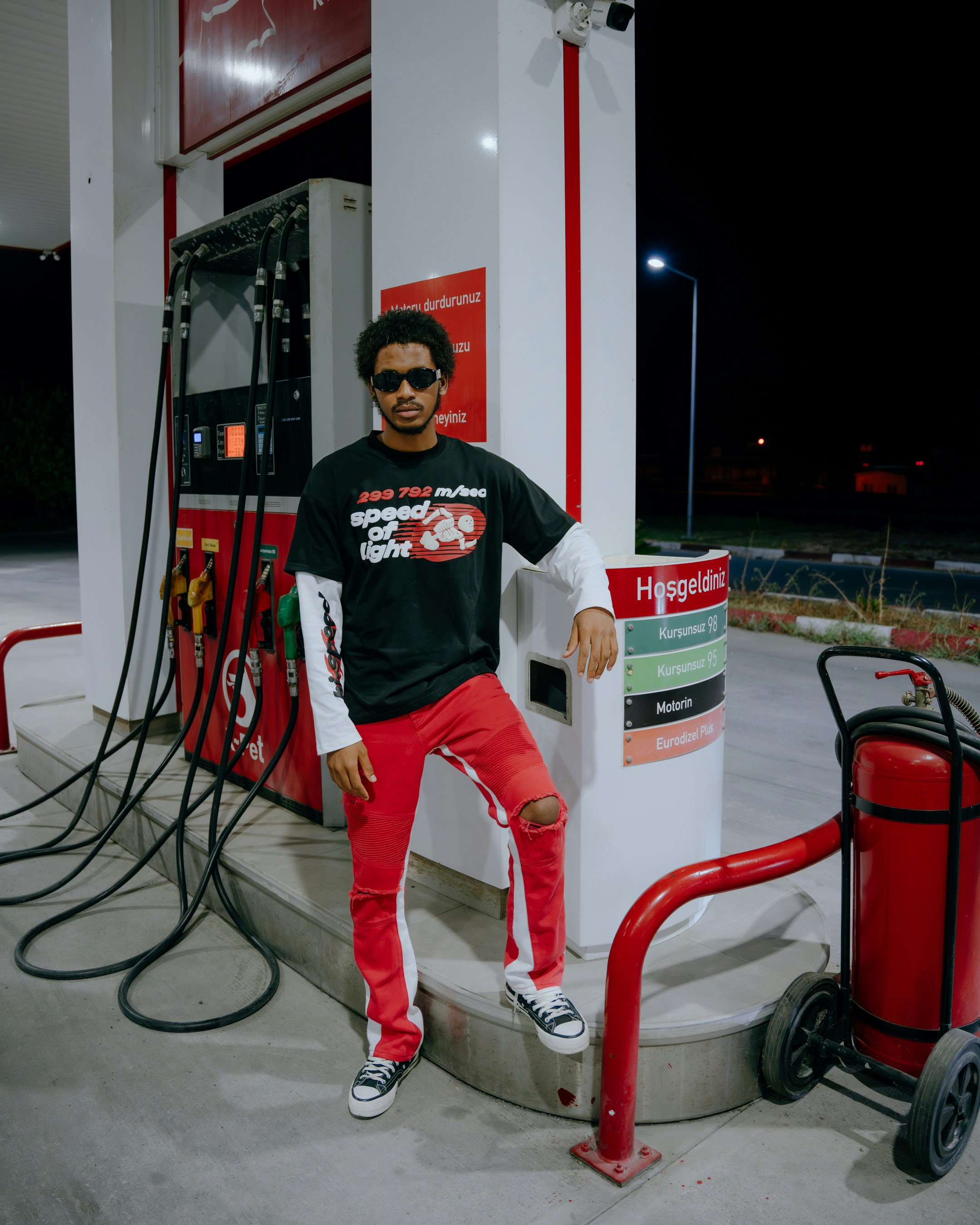 Night Drive: A Confident Stance at the Gas Station